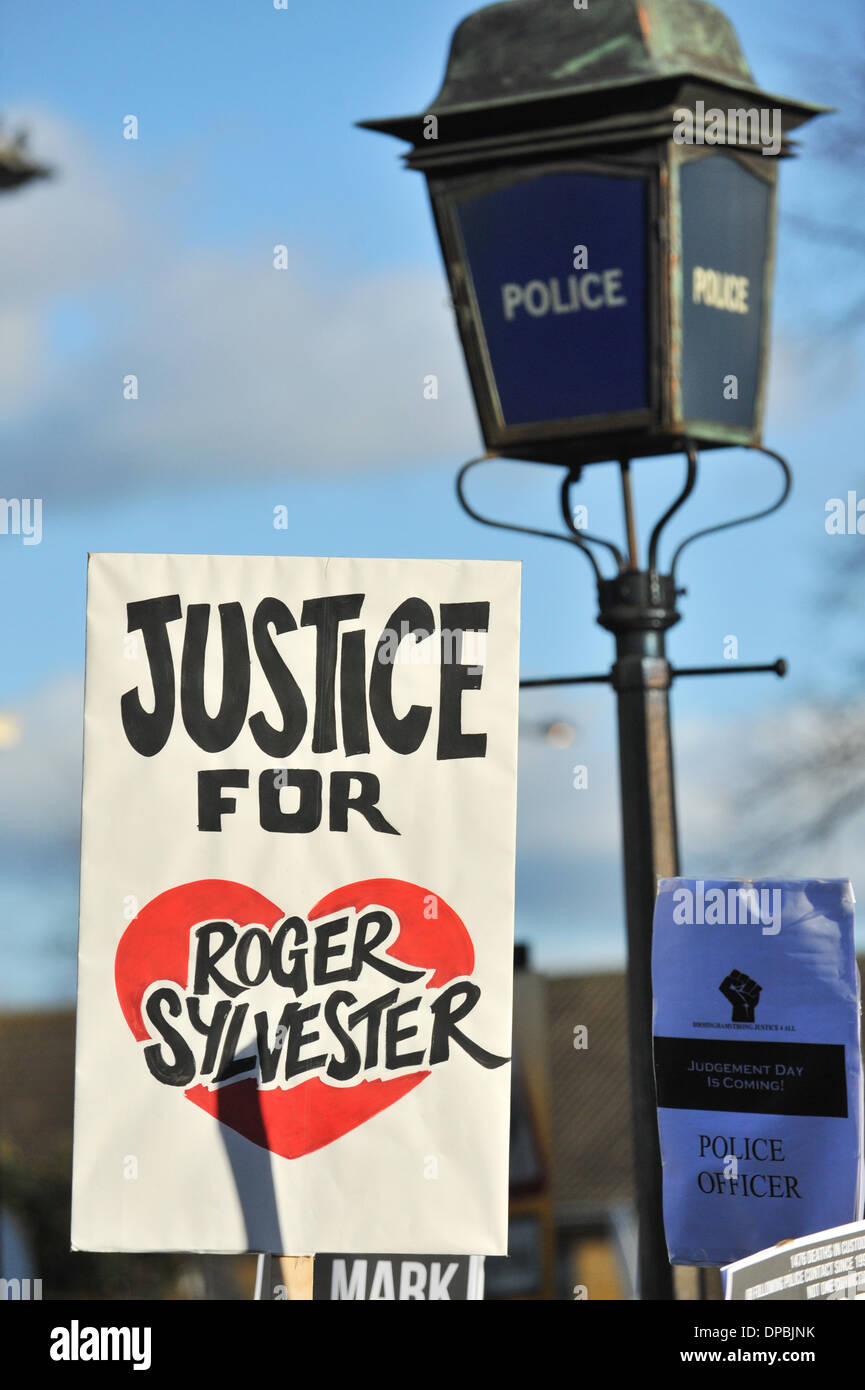 Tottenham High Road, London, UK. 11th January 2014. People hold banners ...
