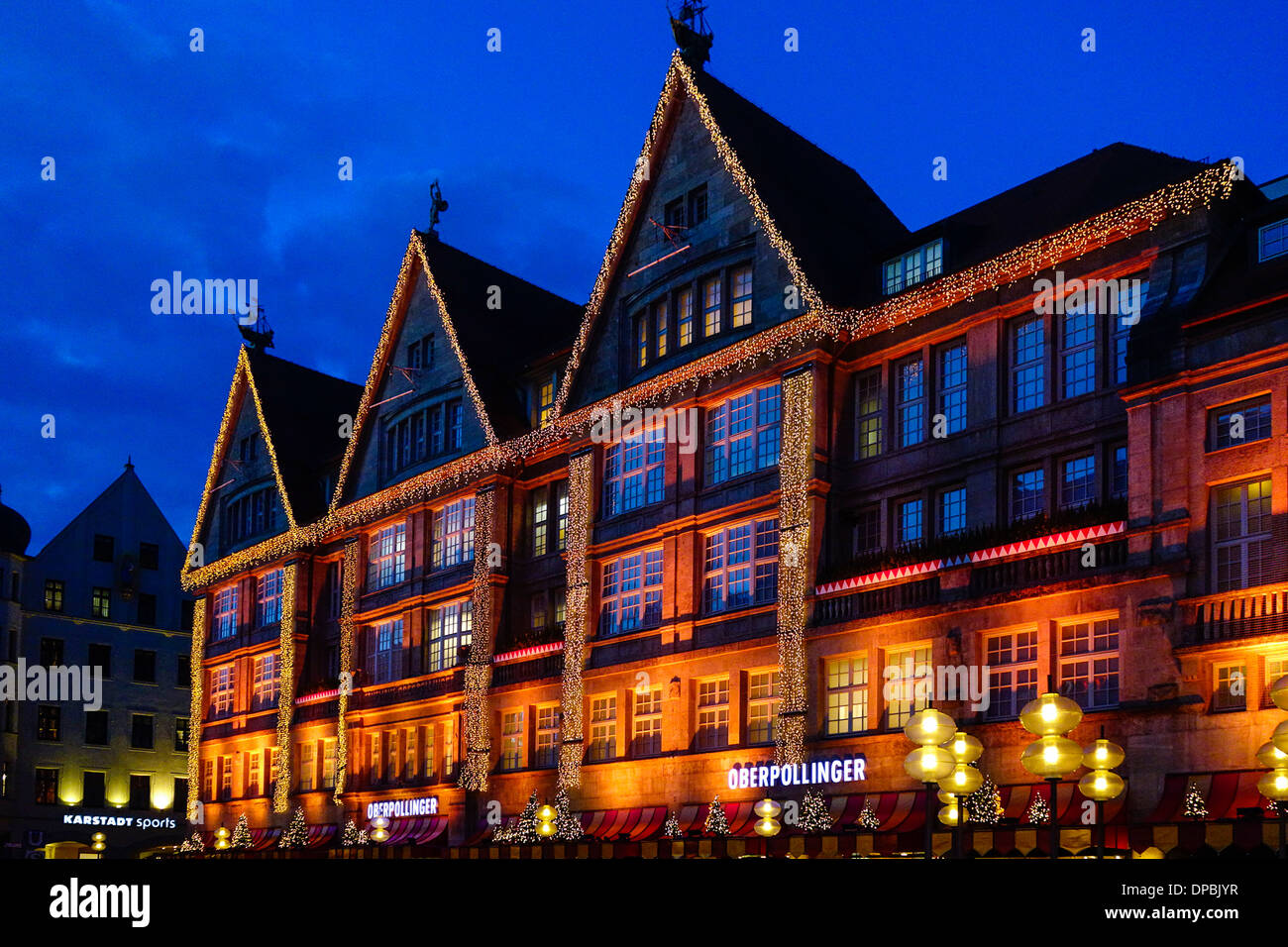 Christmas shopping, colorful illuminated facade of the department store ...