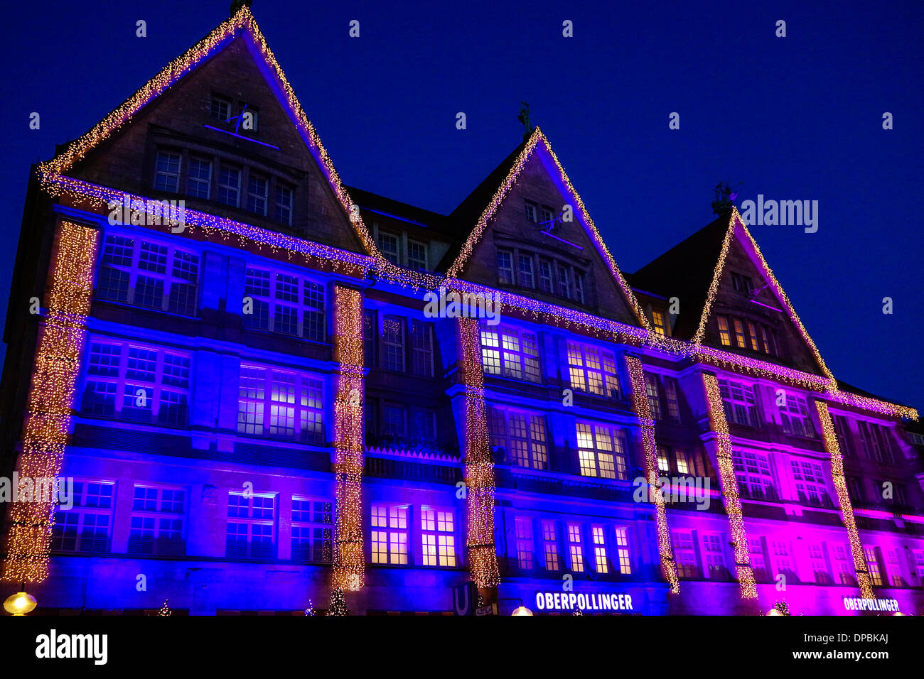 Christmas shopping, colorful illuminated facade of the department store ...