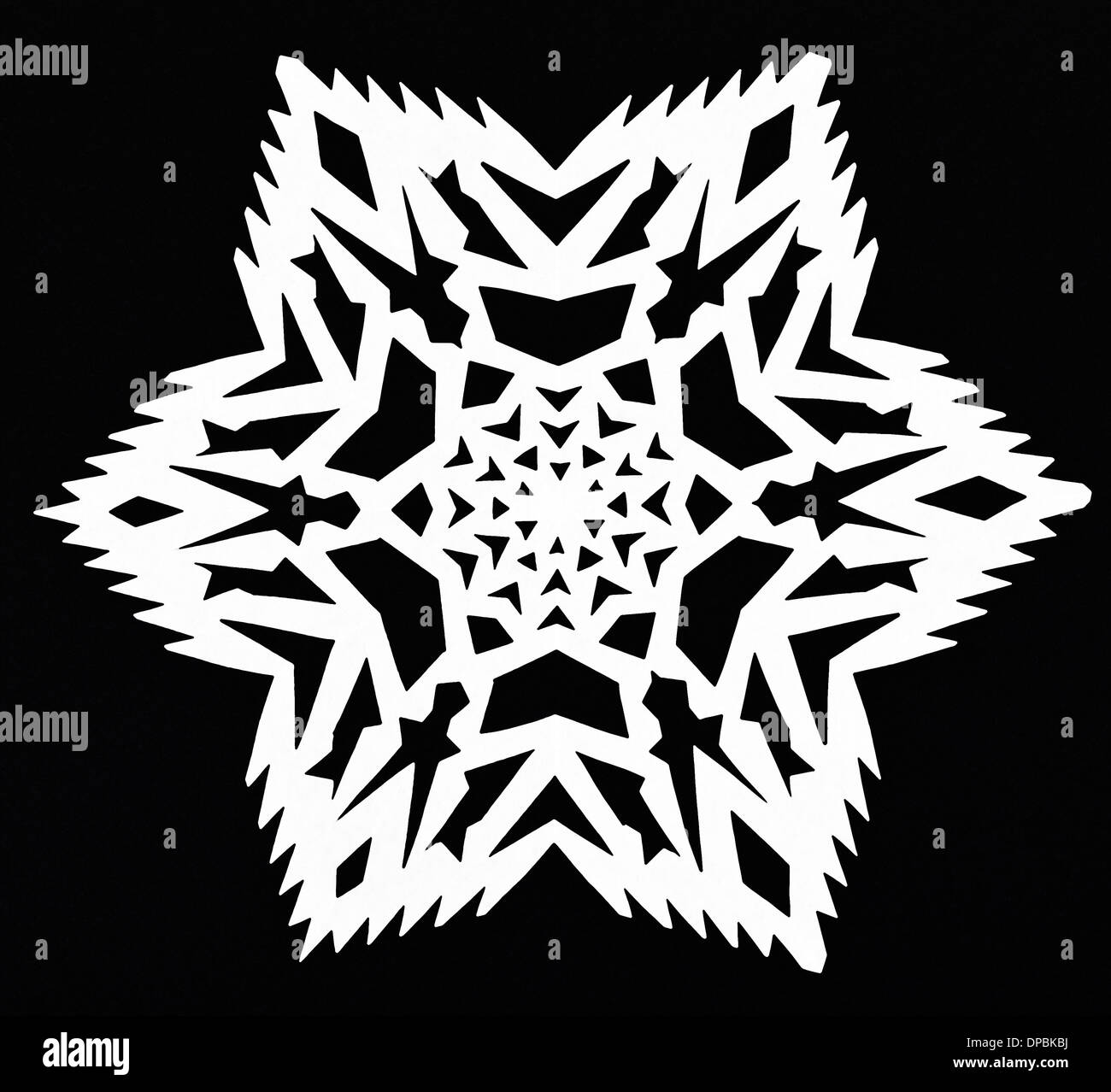 hand made cut out white snowflake on black paper background Stock Photo ...