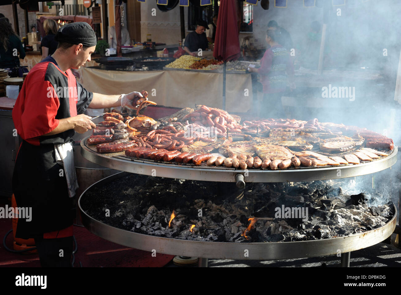 cook handles giant barbecue in the annual All Saints Market in ...