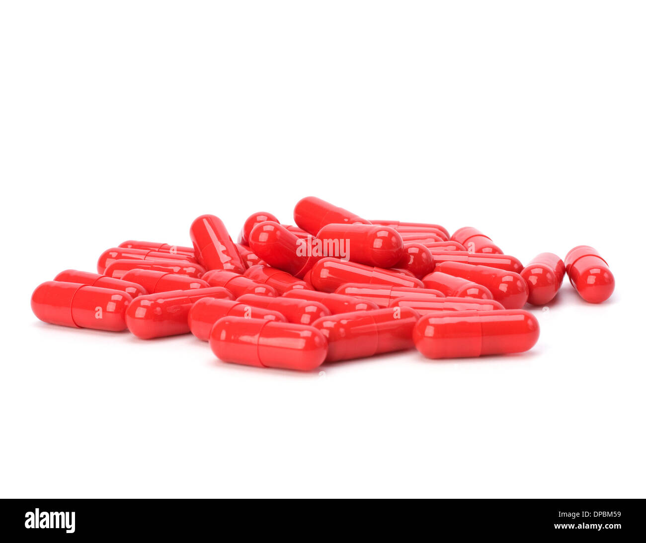 red capsules isolated on white background Stock Photo - Alamy