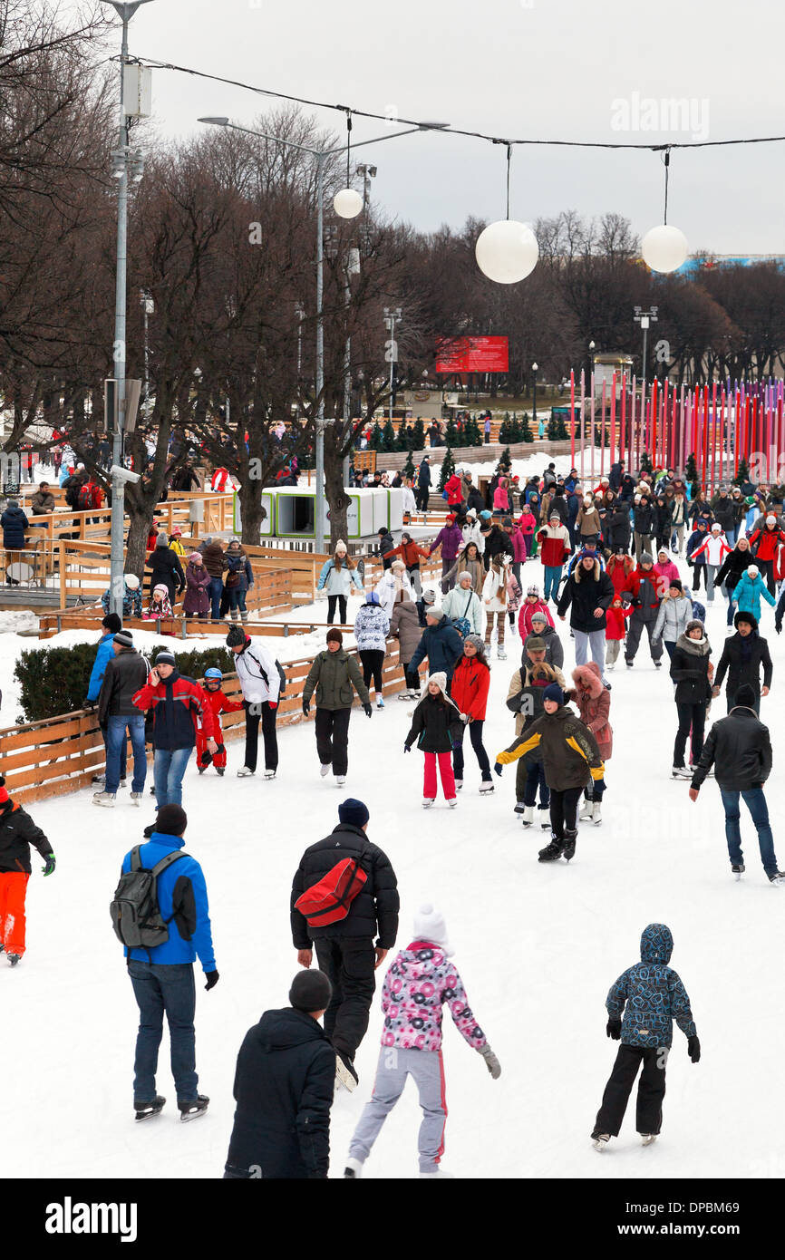 crowds of townspeople skating rink on ice covered paths in Gorky ...