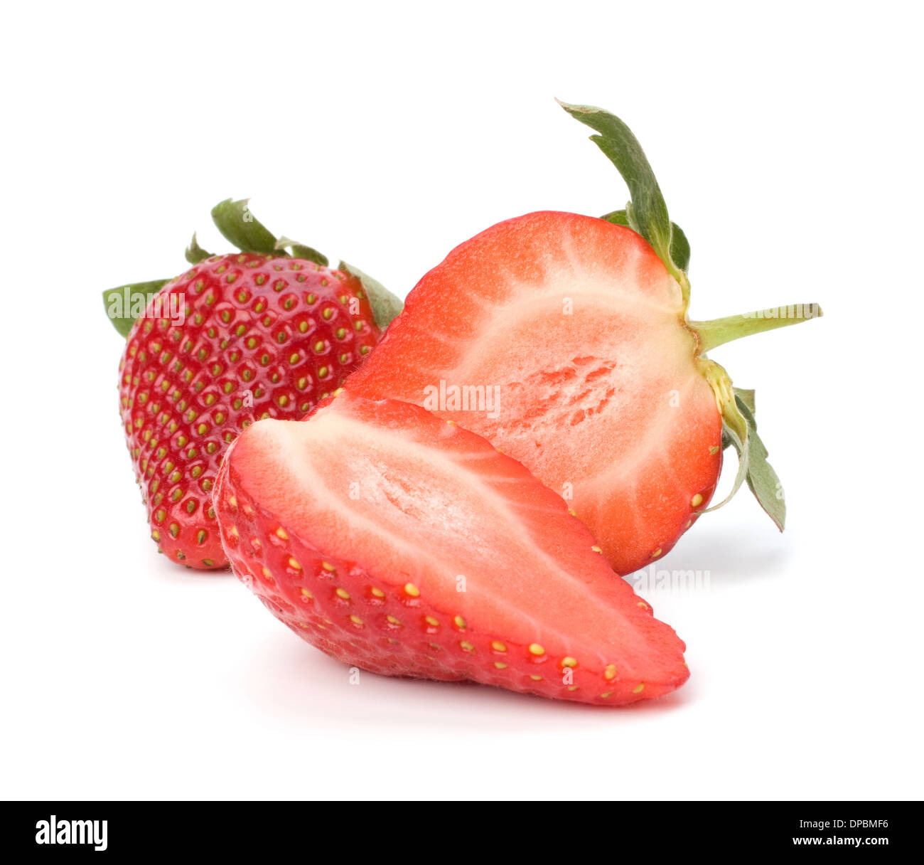 Halved strawberries isolated on white background Stock Photo - Alamy