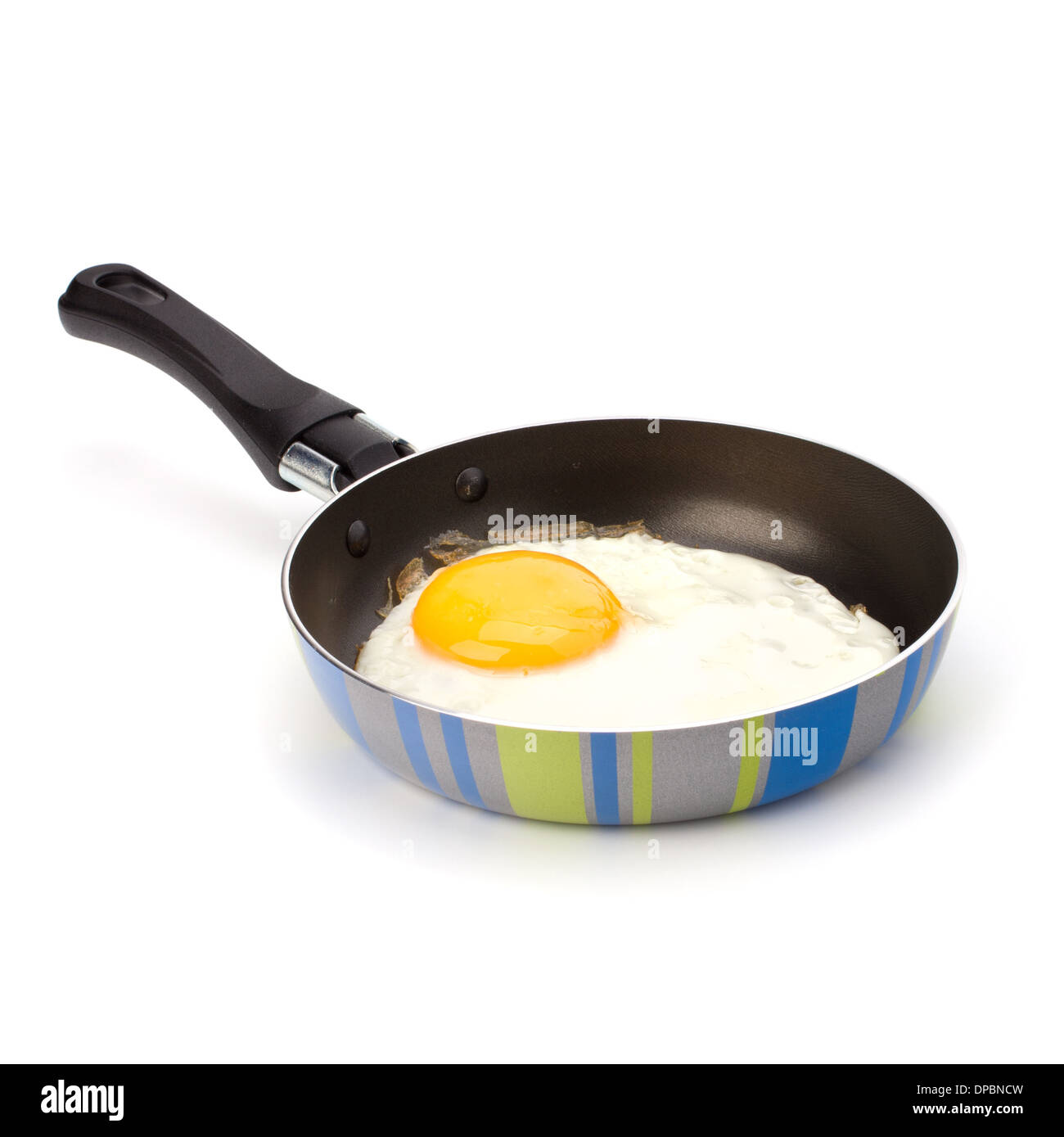 Fried egg on pan over white background Stock Photo - Alamy