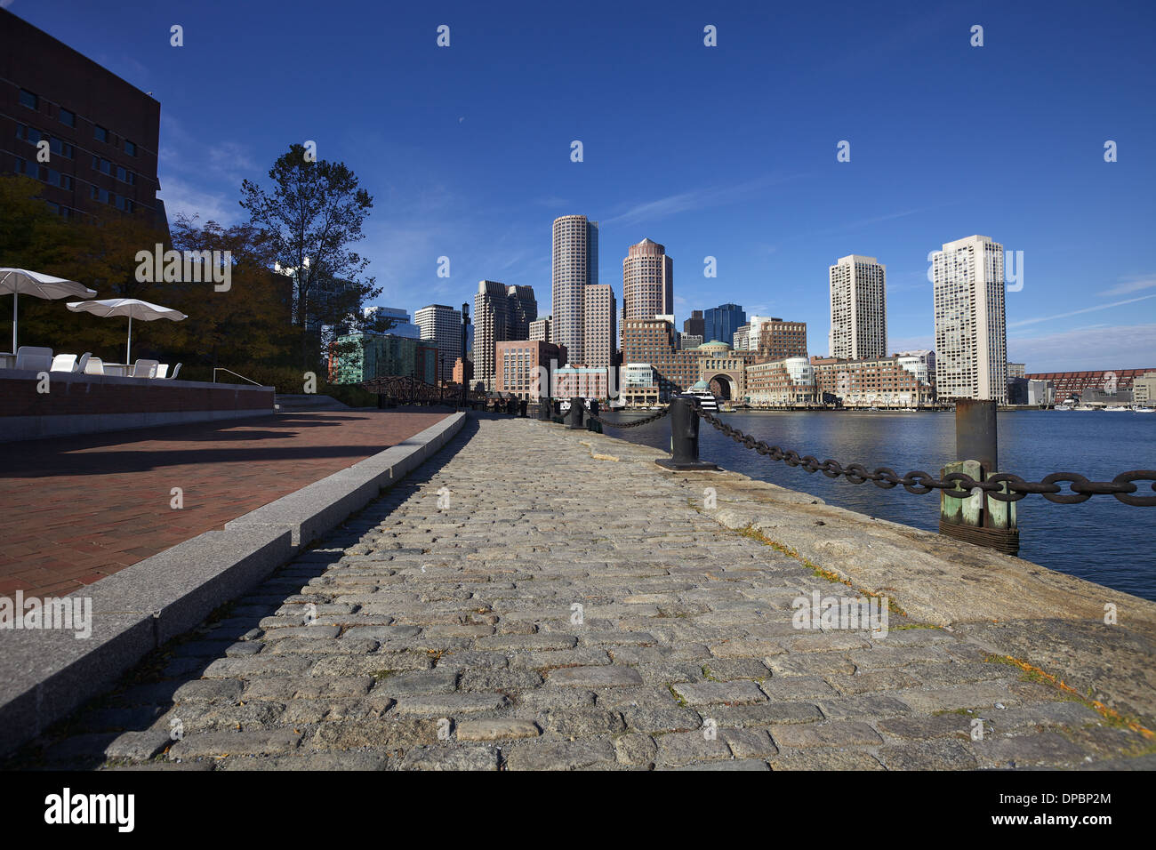The Morning Sun on the Boston Harbor Skyline from Fan Pier Plaza with a ...