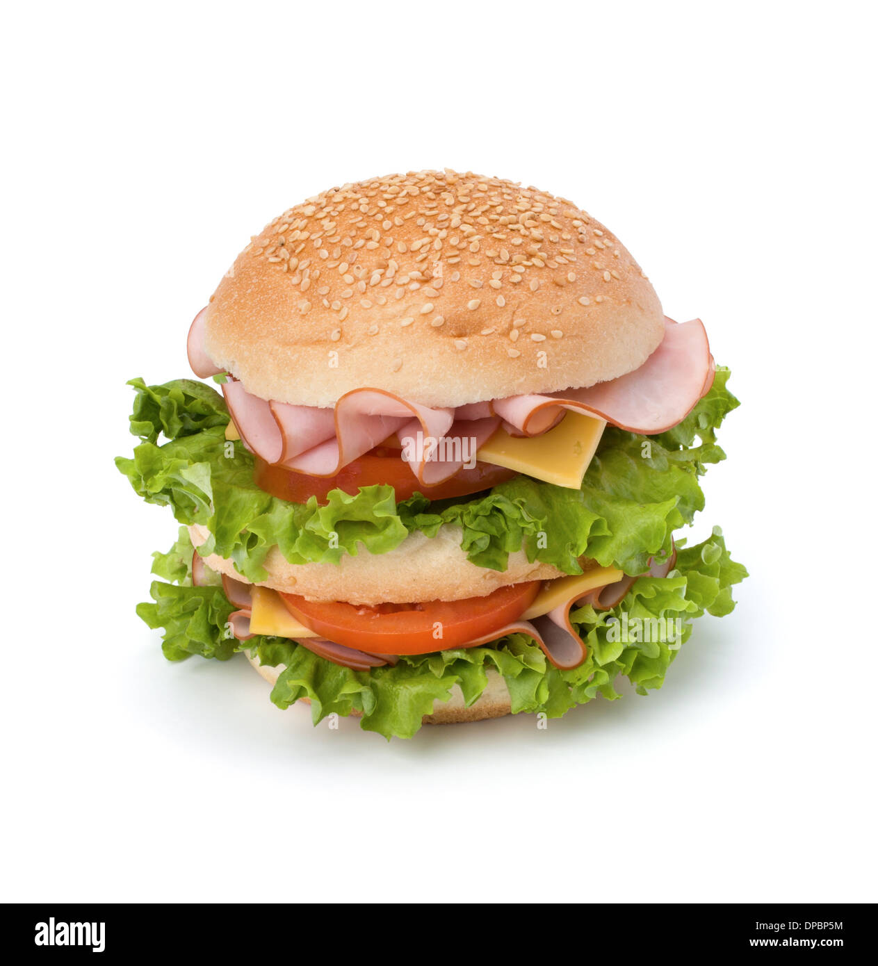 Big appetizing fast food sandwich with lettuce, tomato, smoked ham and ...