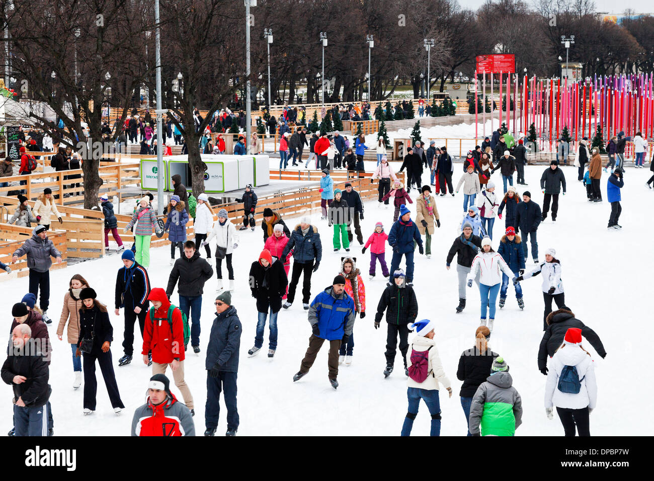 crowds of townsfolk skating rink on ice covered paths in Gorky Central ...