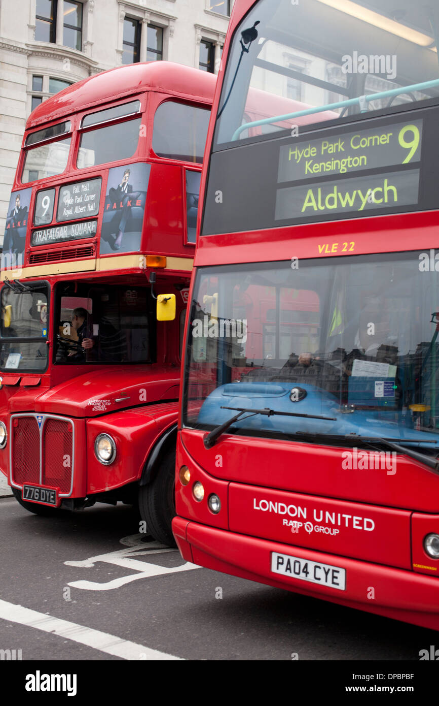 The old and the new red double decker buses in London Stock Photo - Alamy