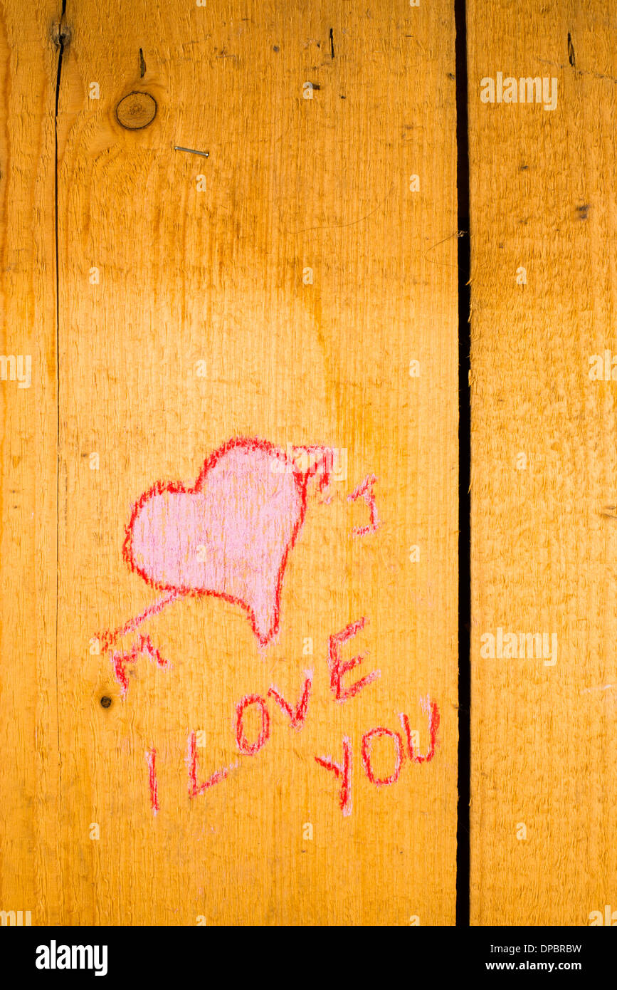 Valentines graffiti on the planks of an old wooden door Stock Photo - Alamy