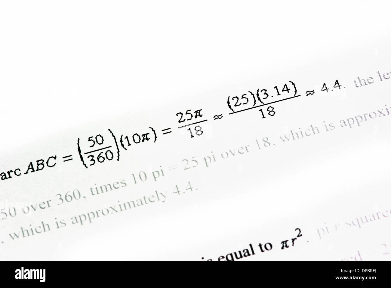 Mathematics calculations on white paper as background Stock Photo - Alamy