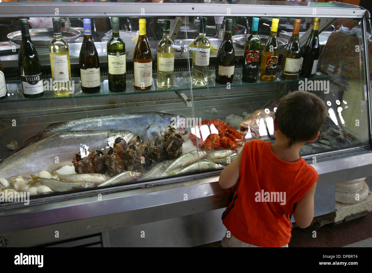 Small boy at the fresh fish market, Mercado Central (central market) in ...