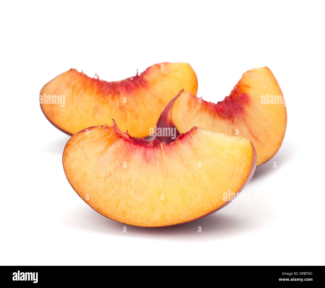 Nectarine fruit segments isolated on white background Stock Photo - Alamy