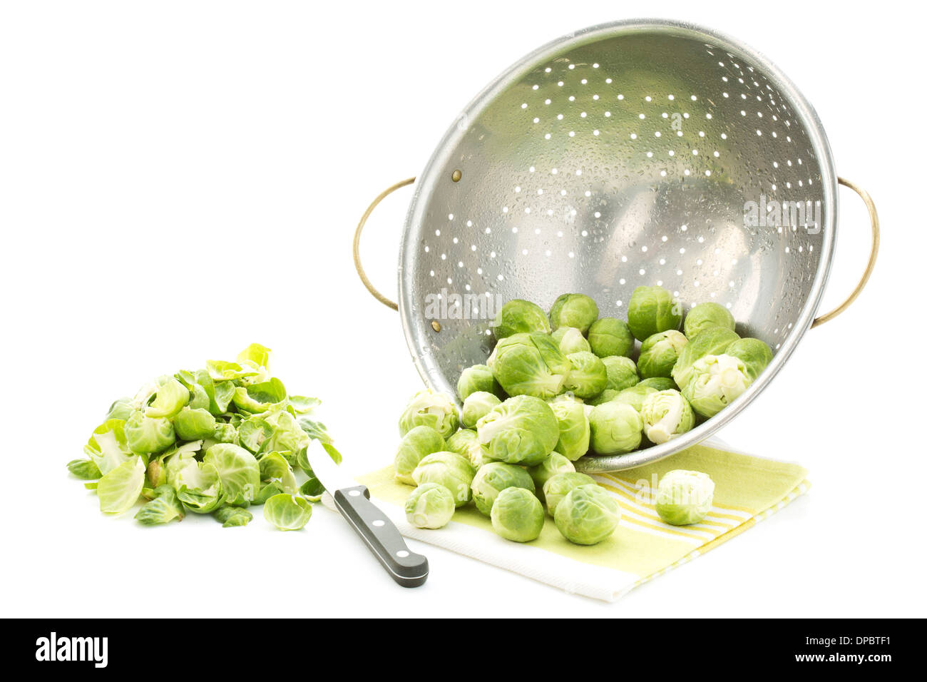 Brussel sprout in colander, knife, kitchen towel Stock Photo - Alamy