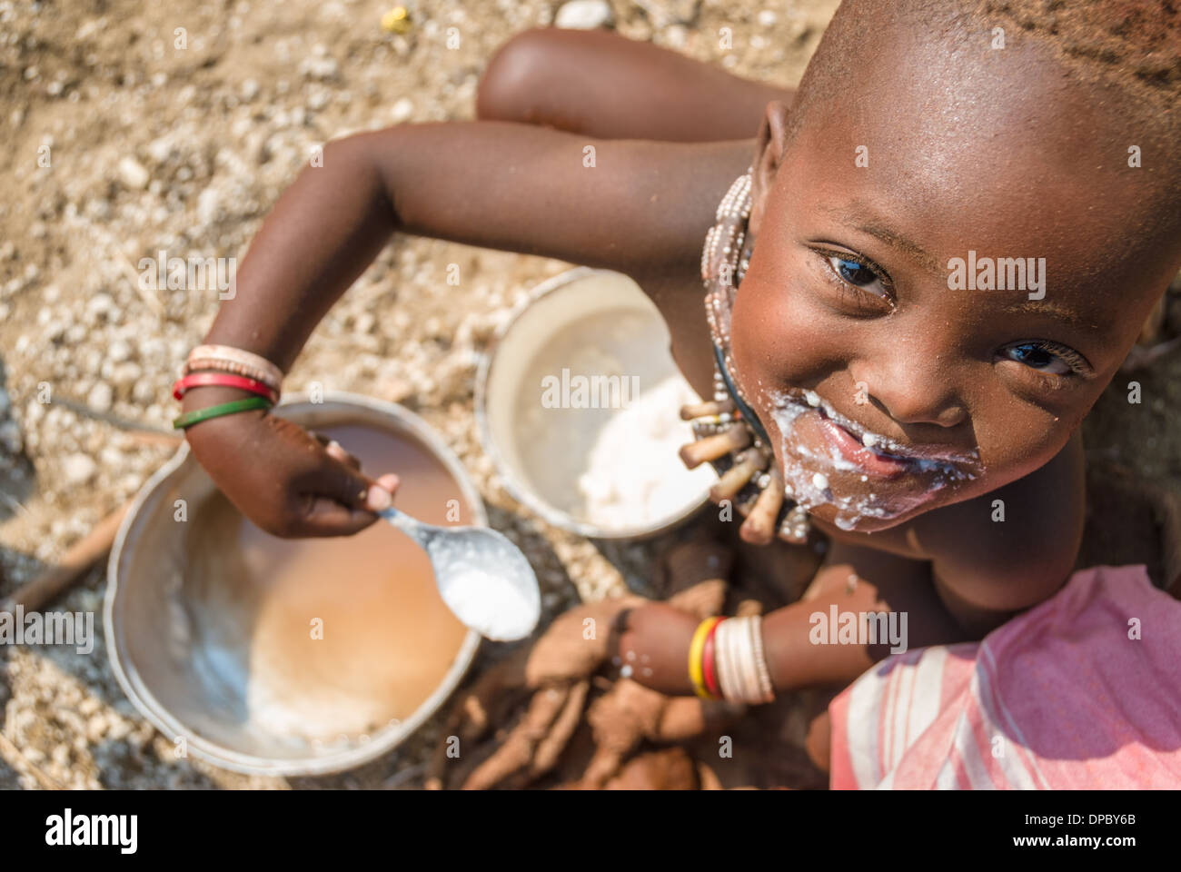 Young himba eating porridge from hi-res stock photography and images ...