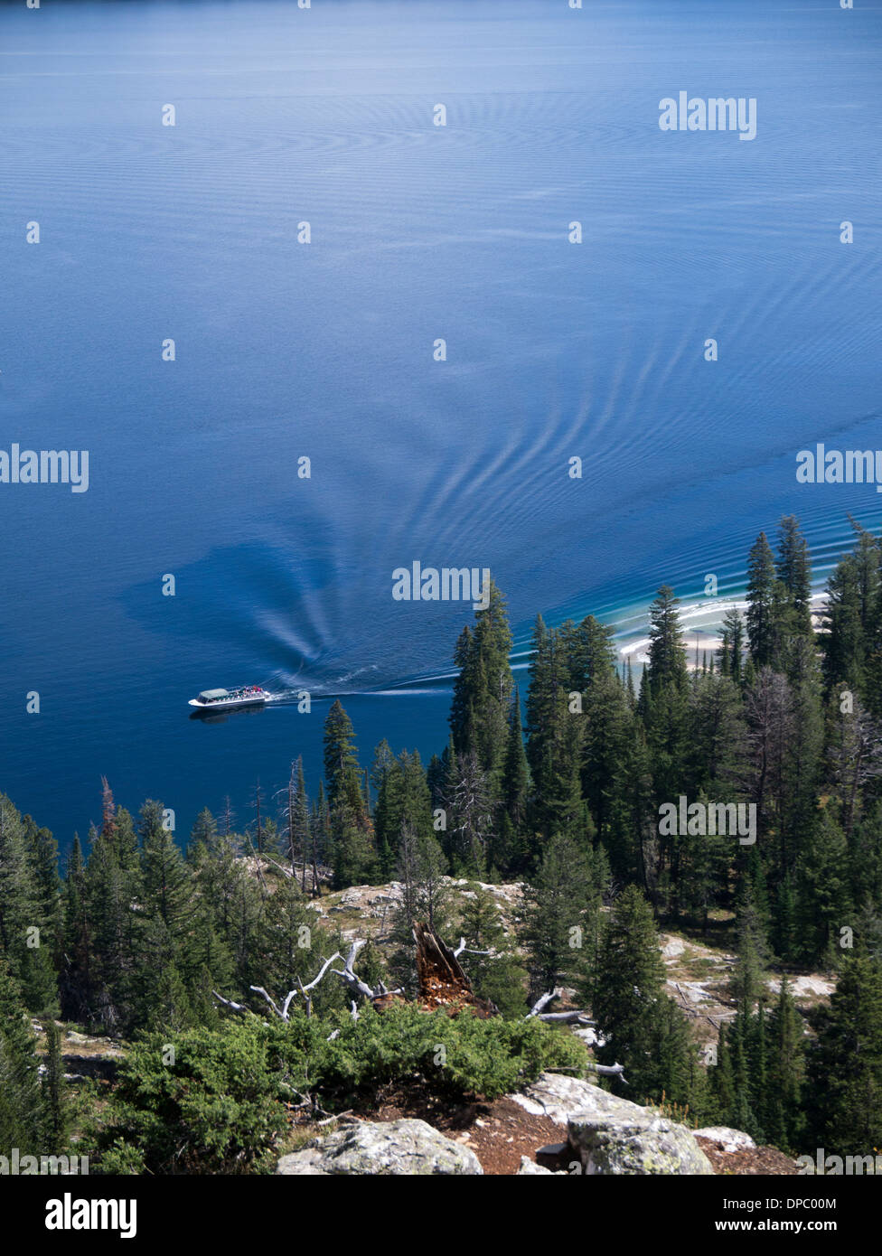 Tourist shuttle boat arriving at west shore boat dock on Jenny Lake in ...