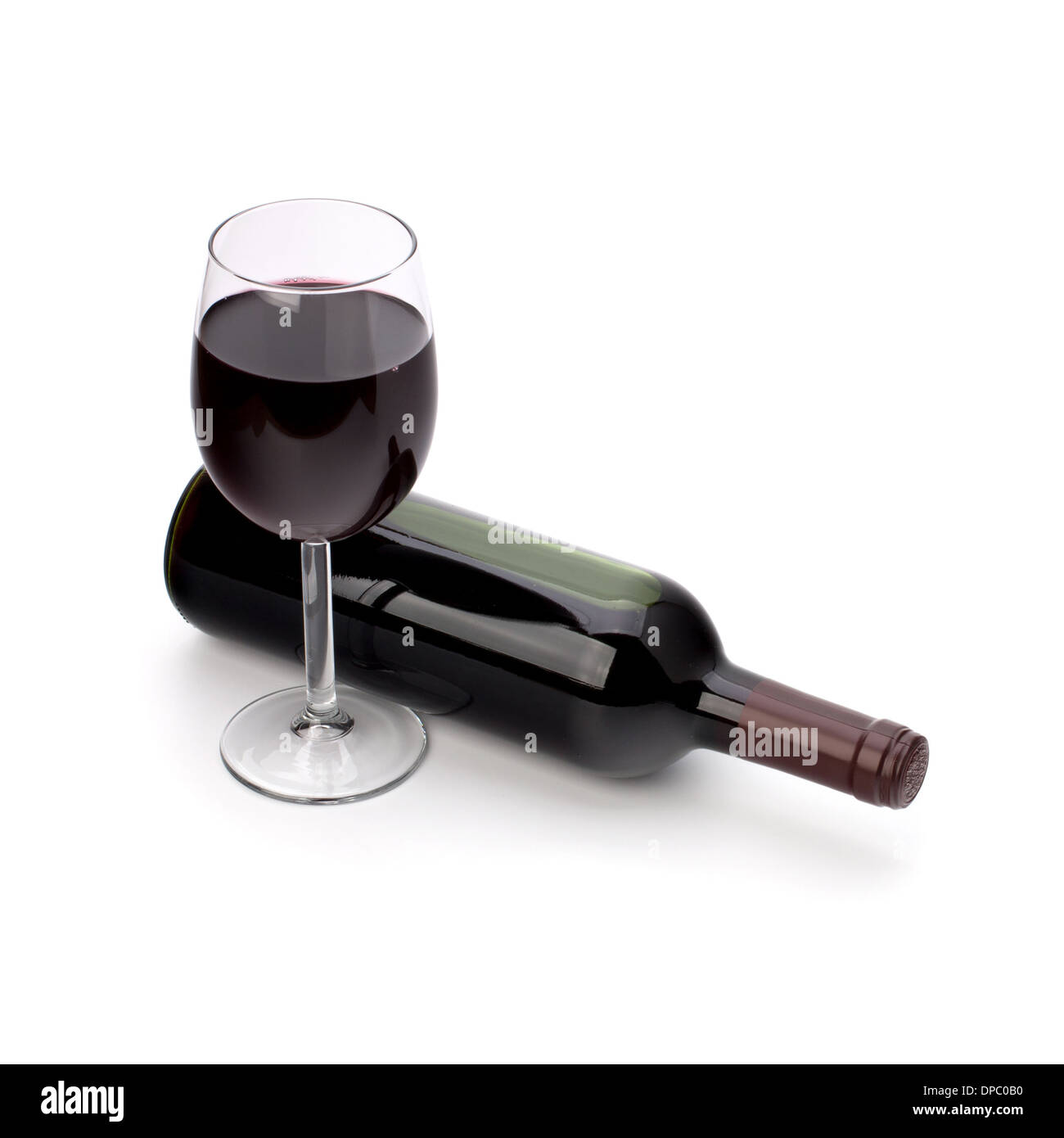 Full red wine glass goblet and bottle isolated on white background ...