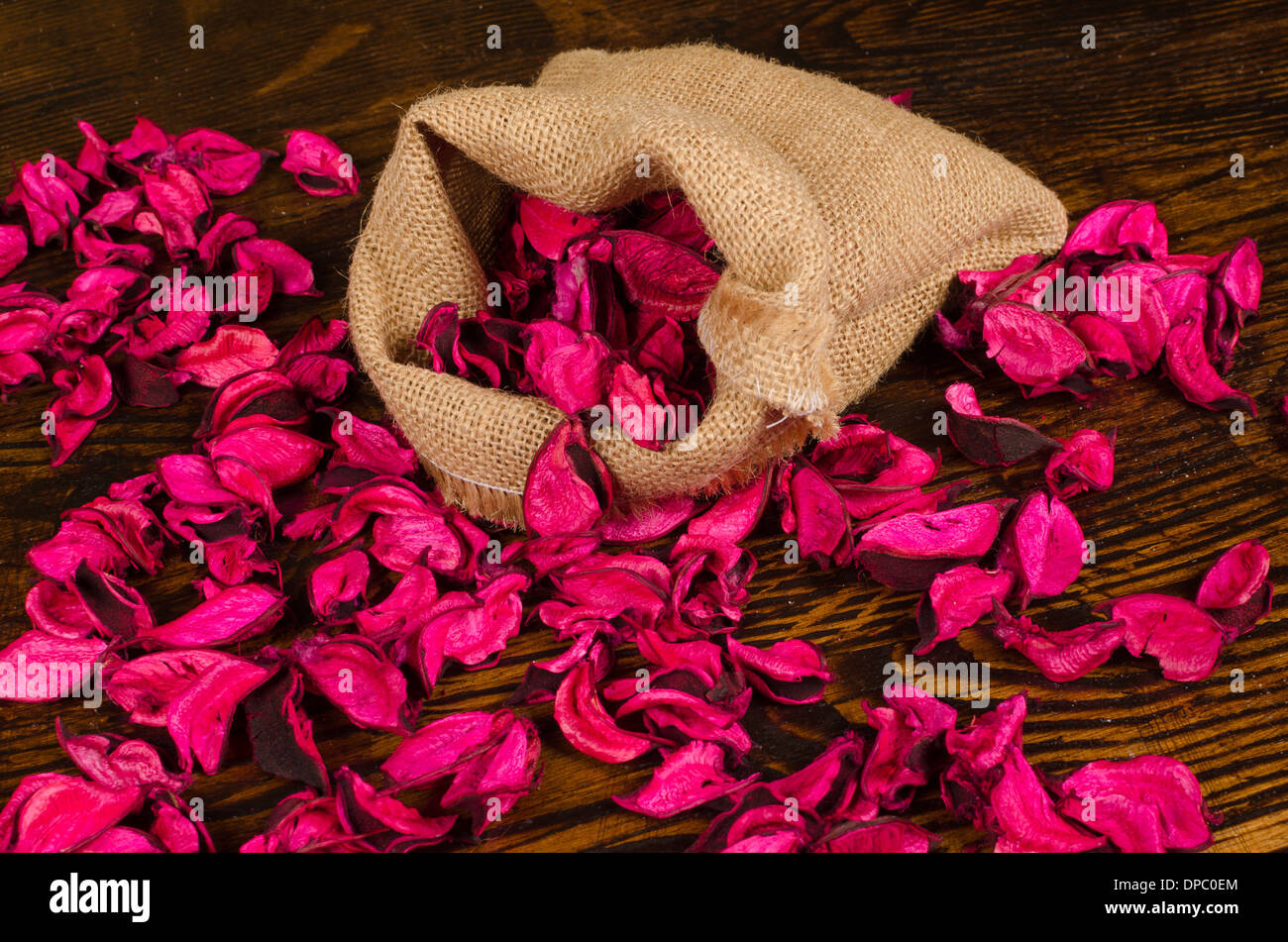 Dried flower petals scattered from inside a sack Stock Photo - Alamy