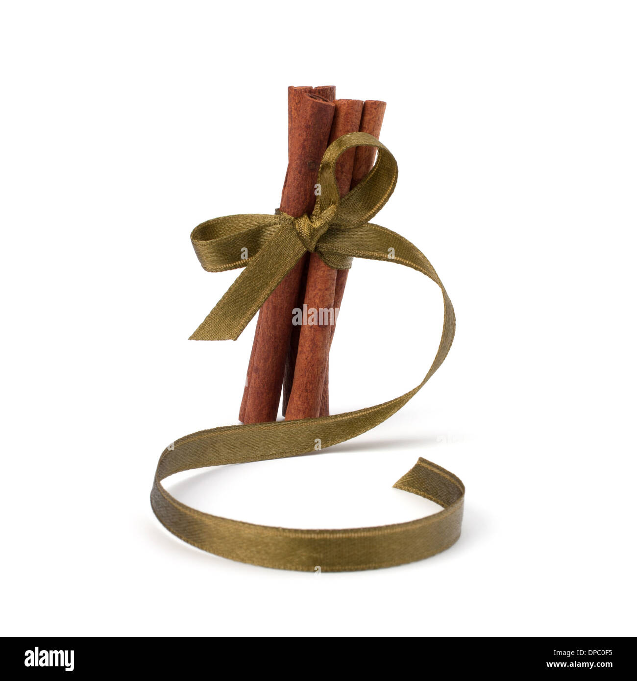 Festive wrapped cinnamon sticks isolated on white background Stock ...