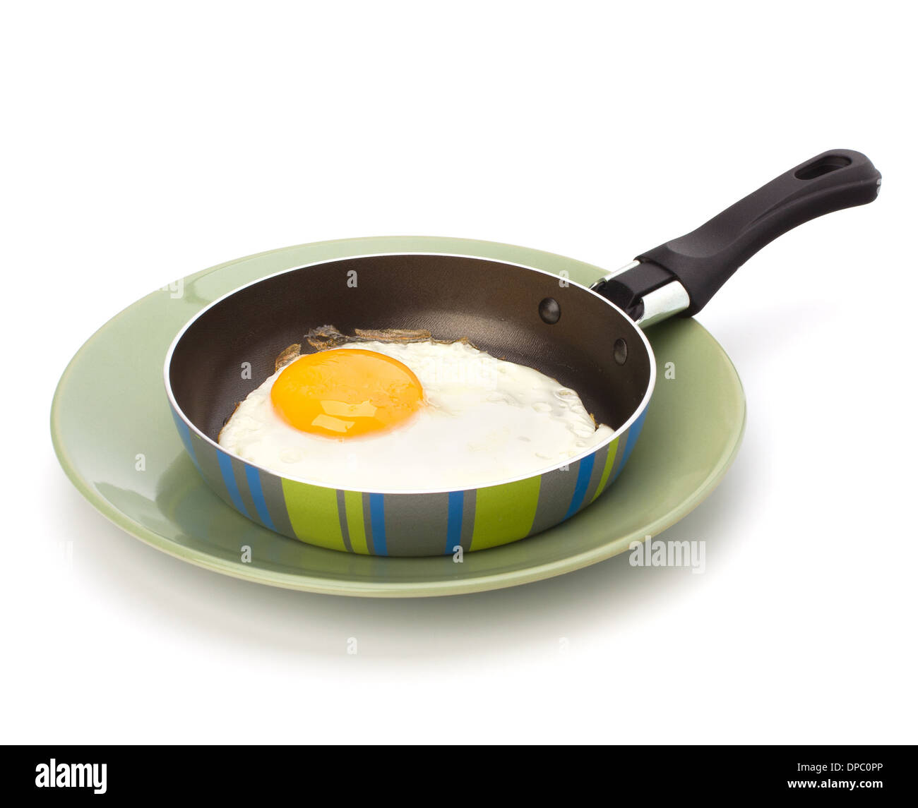 Fried egg on pan over white background Stock Photo - Alamy