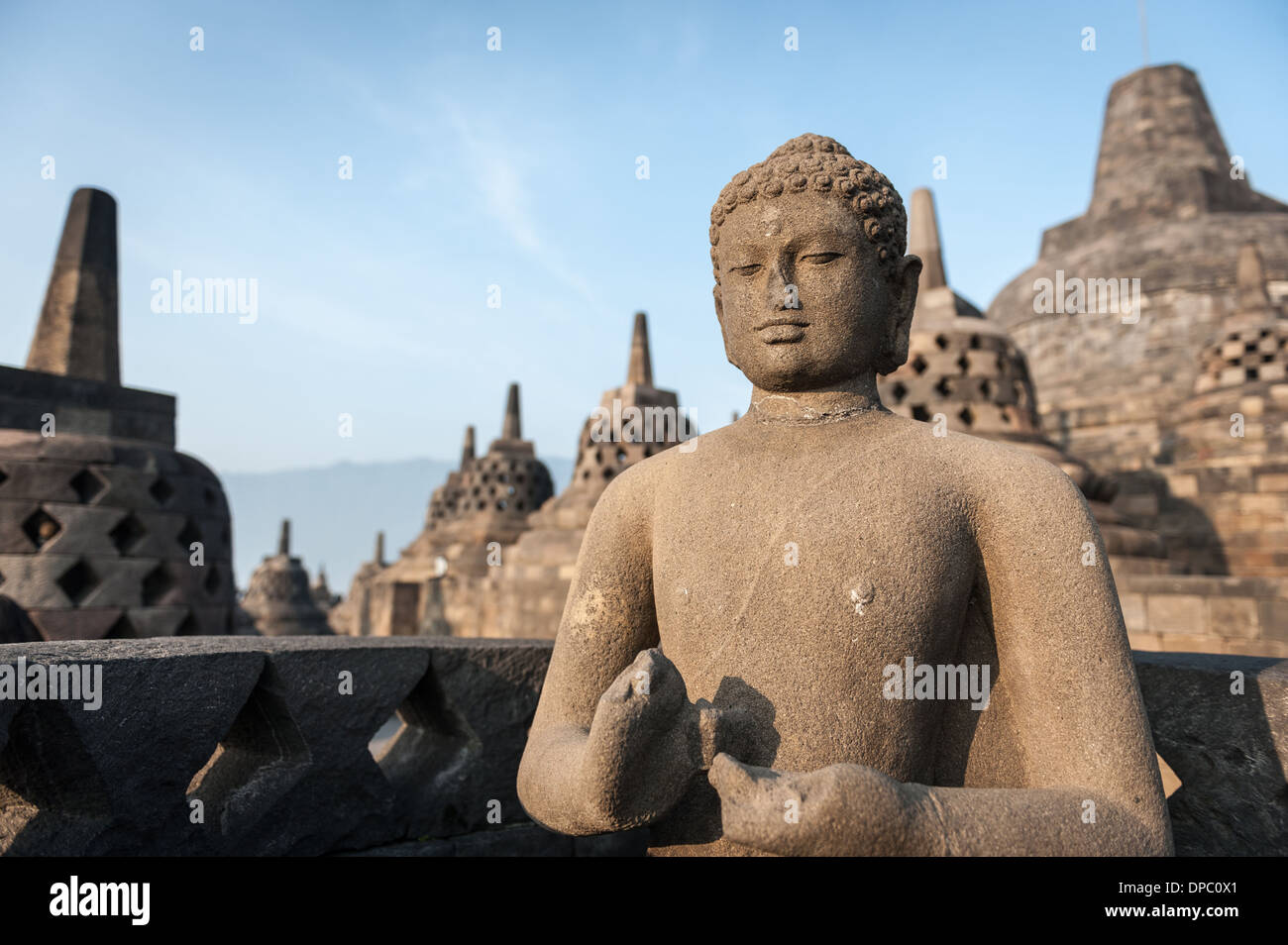 Sunrising over the stupas of the Buddhist temple of Borobudur, Java ...