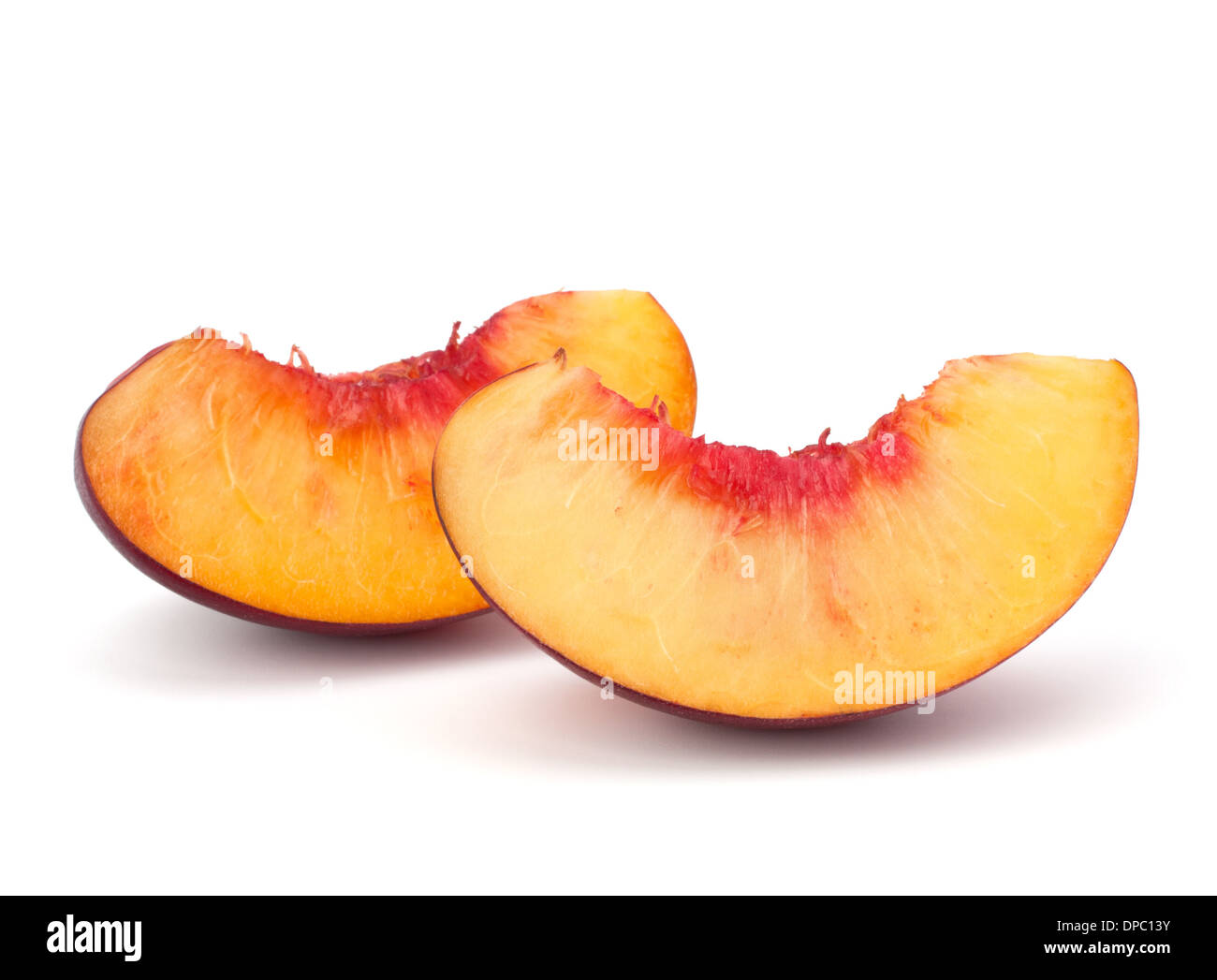 Nectarine fruit segments isolated on white background Stock Photo - Alamy