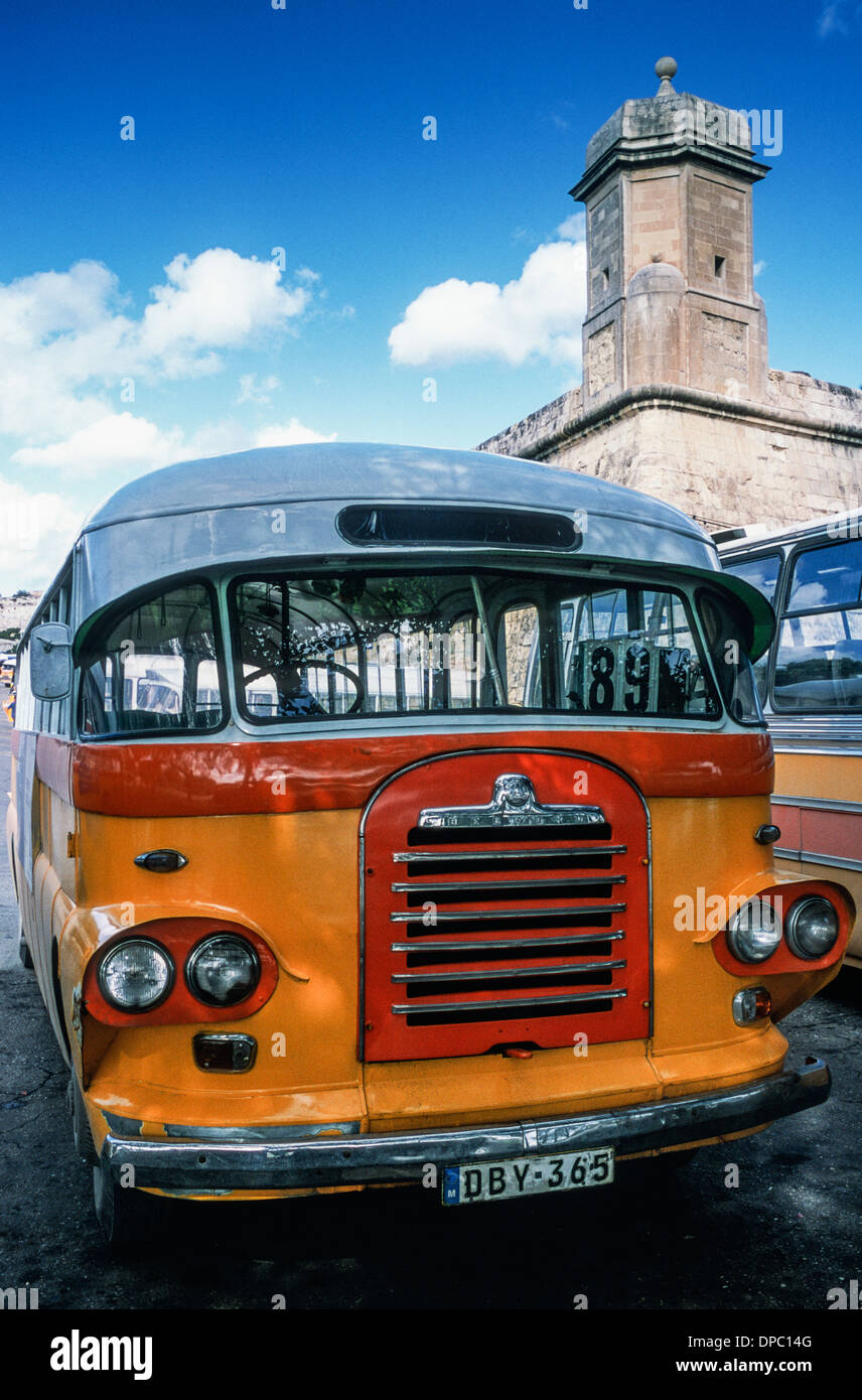 Yellow bus in Valetta, Malta Stock Photo - Alamy