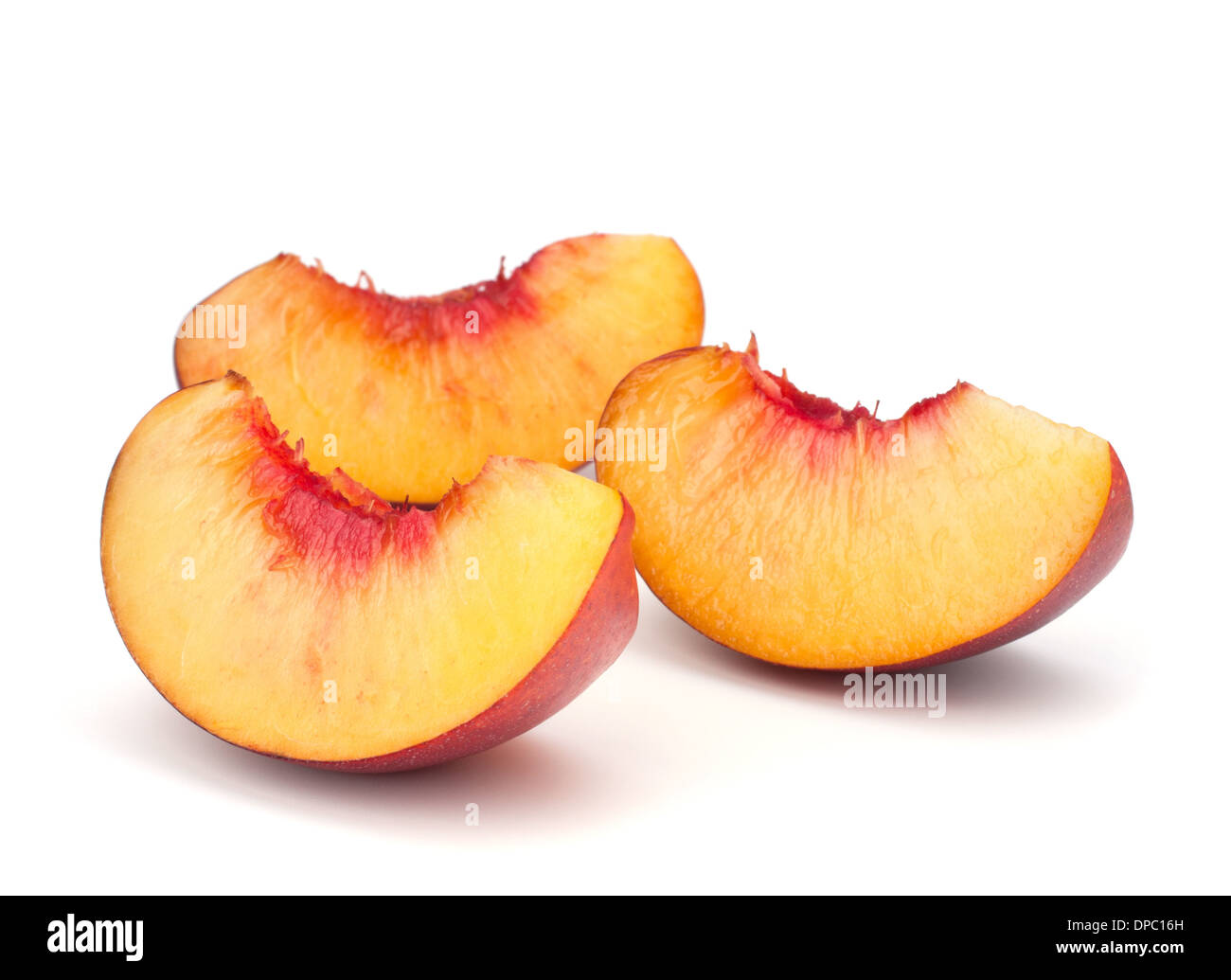 Nectarine fruit segments isolated on white background Stock Photo - Alamy