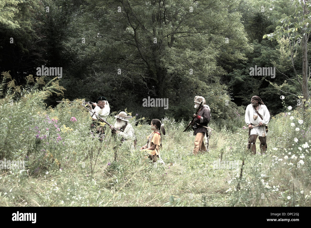 Mountainmen trappers and a Native American Indian boy go hunting Stock ...