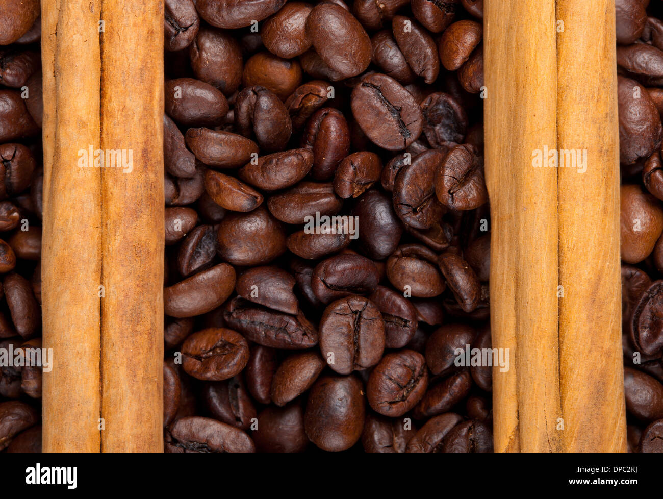 Frame with coffee beans and ceylon cinnamon on wooden table Stock Photo ...