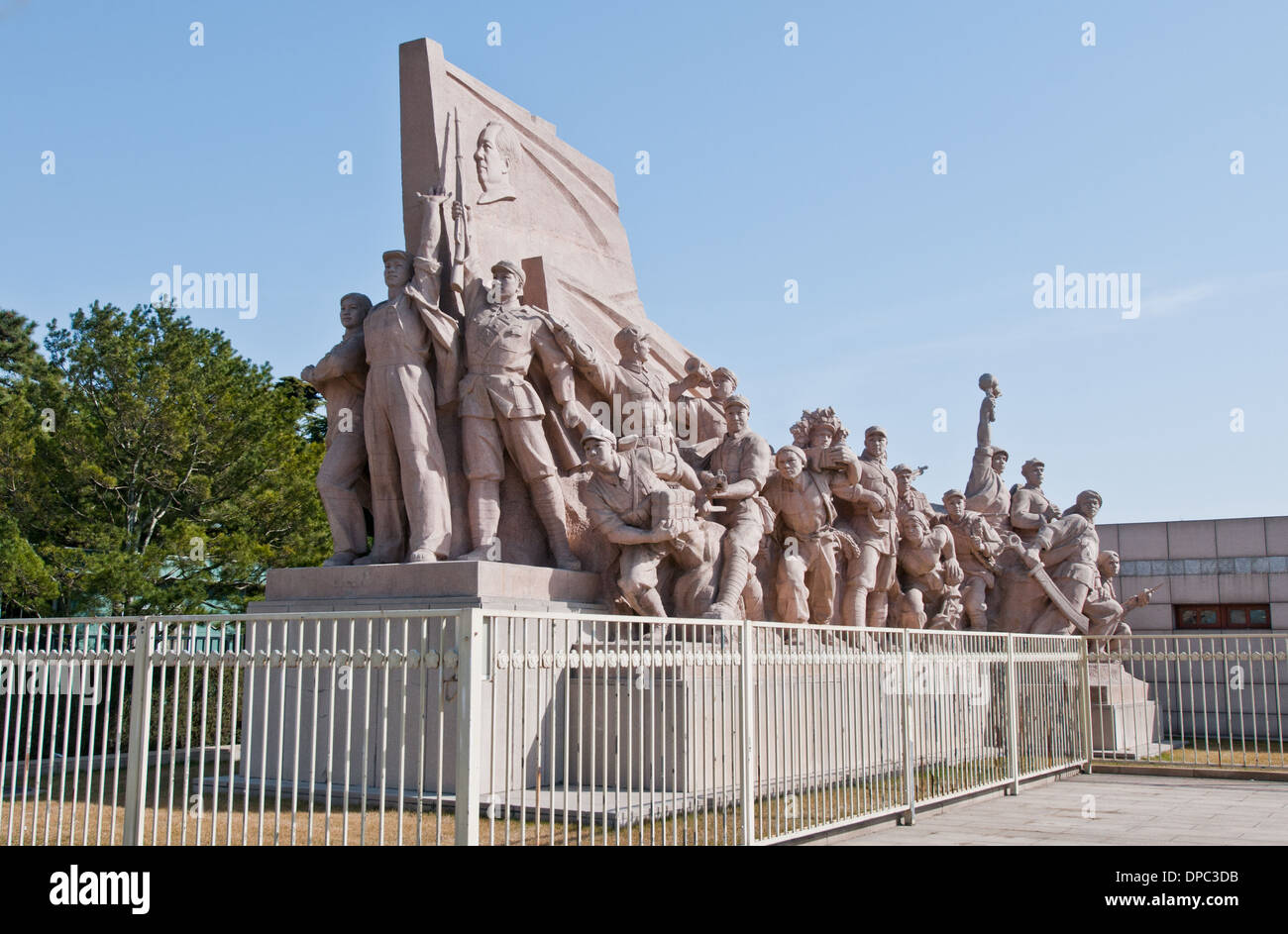 Stone revolutionary monument in front of Mausoleum of Mao Zedong at ...