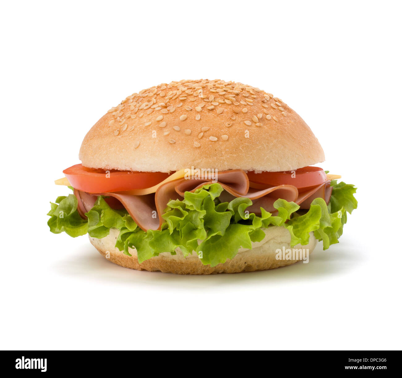 Big appetizing fast food sandwich with lettuce, tomato, smoked ham and ...
