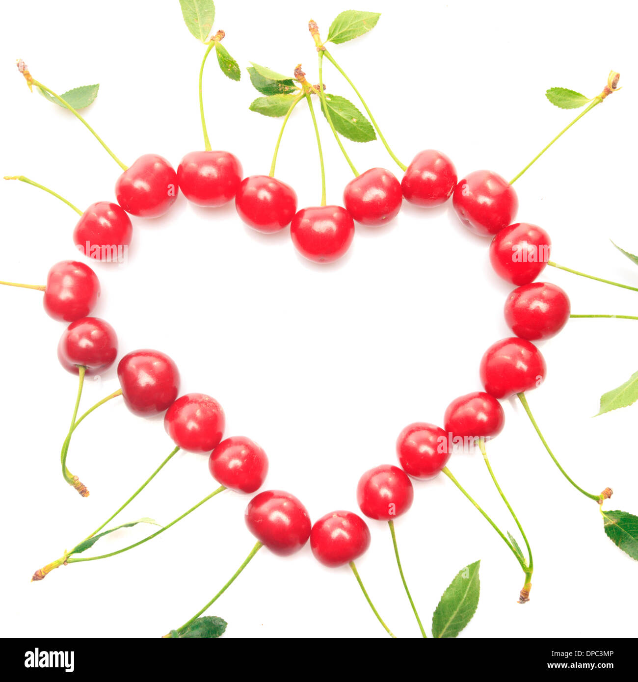 Heart shape from cherries with green leaves isolated on white Stock ...