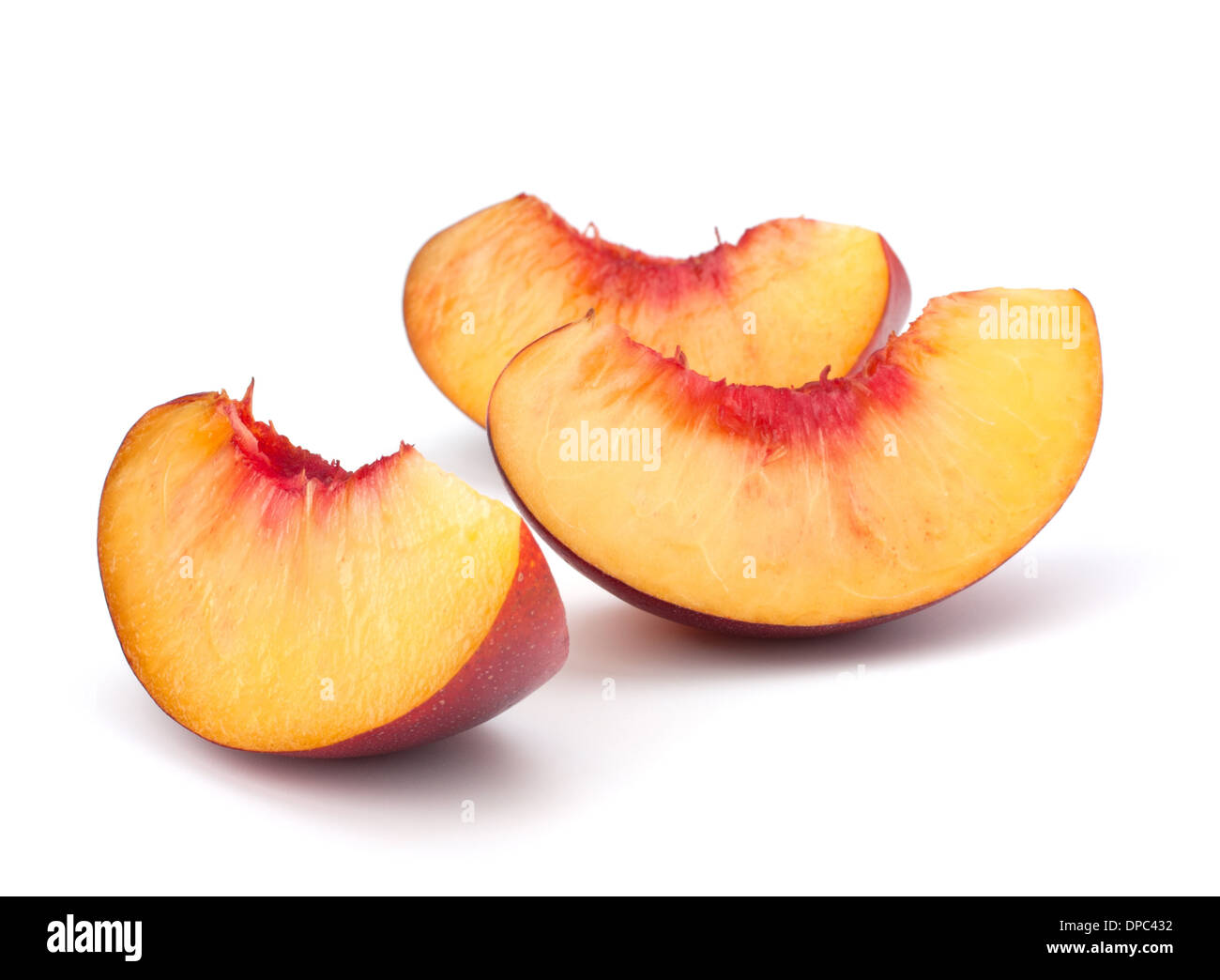 Nectarine fruit segments isolated on white background Stock Photo - Alamy