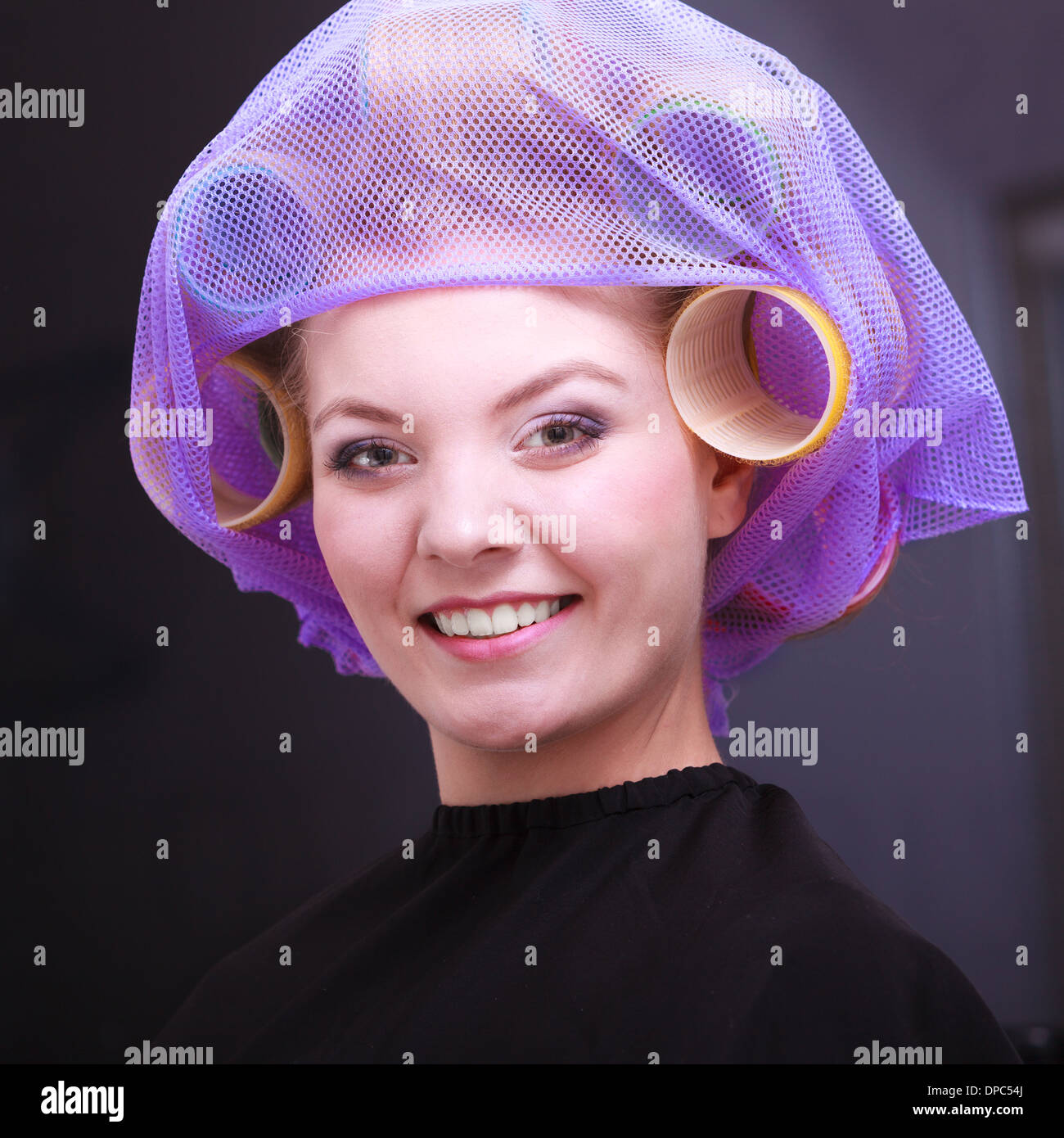 Portrait beautiful young woman in beauty salon. Blond girl with hair ...