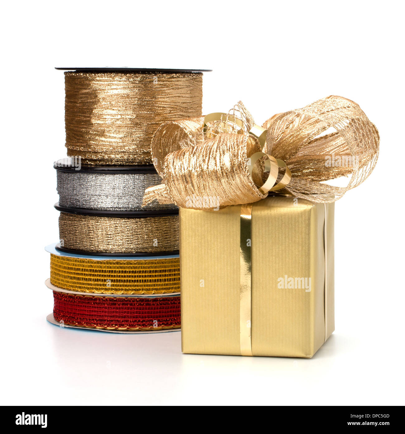Festive gift box and wrapping ribbons isolated on white background ...