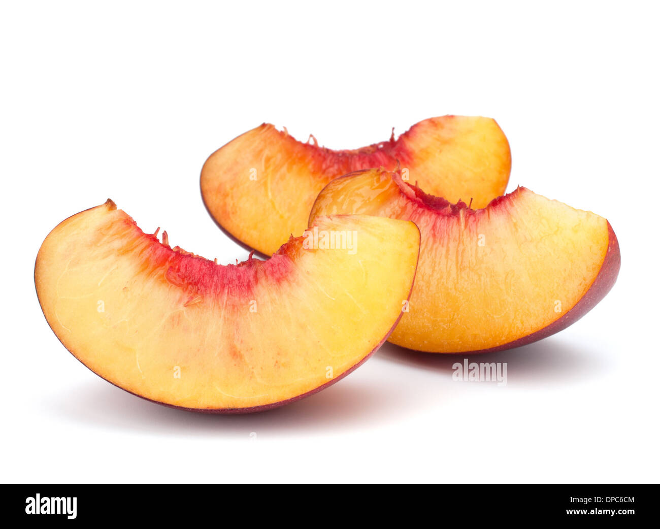 Nectarine fruit segments isolated on white background Stock Photo - Alamy