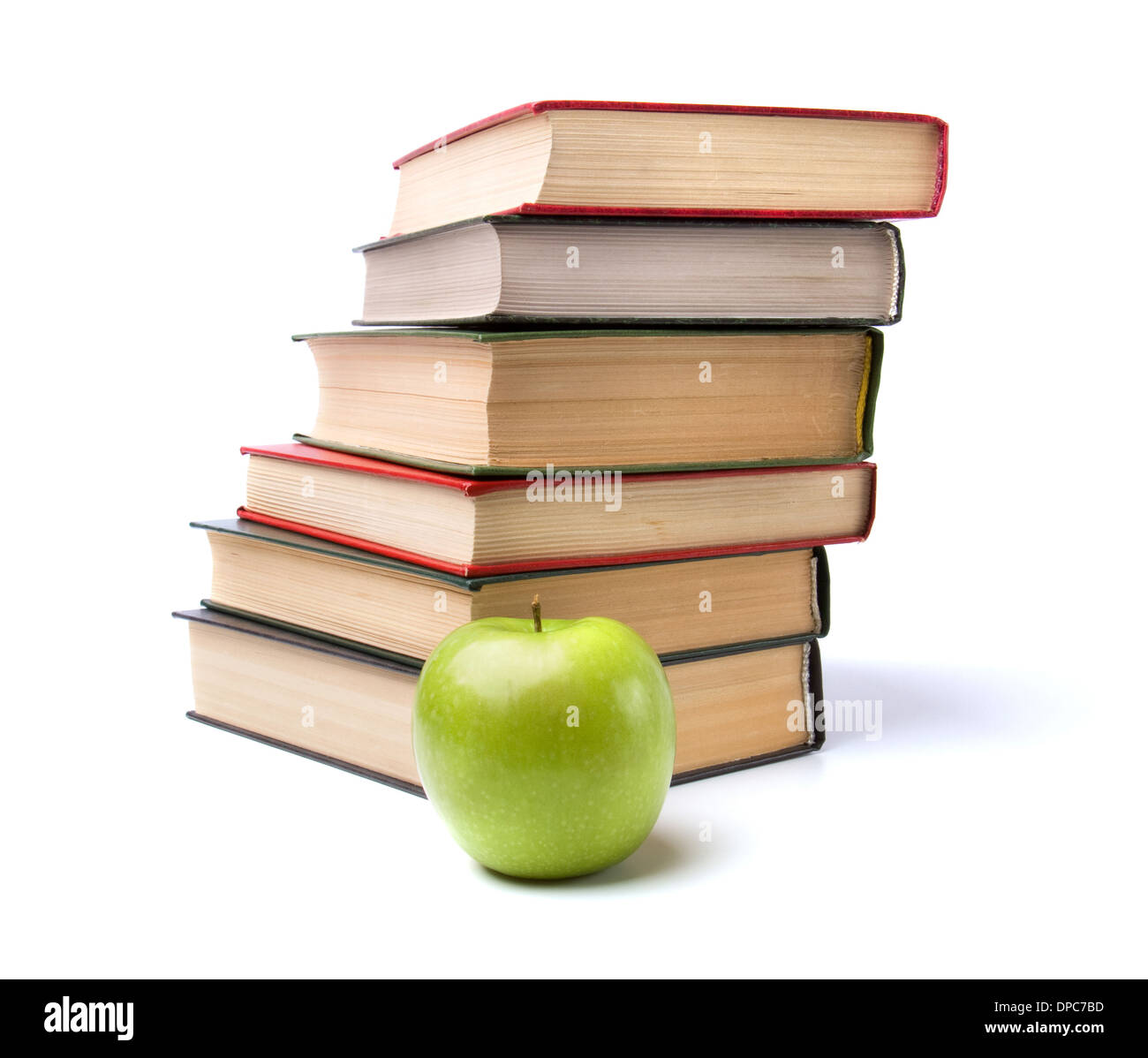 book stack with apple isolated on white background Stock Photo - Alamy