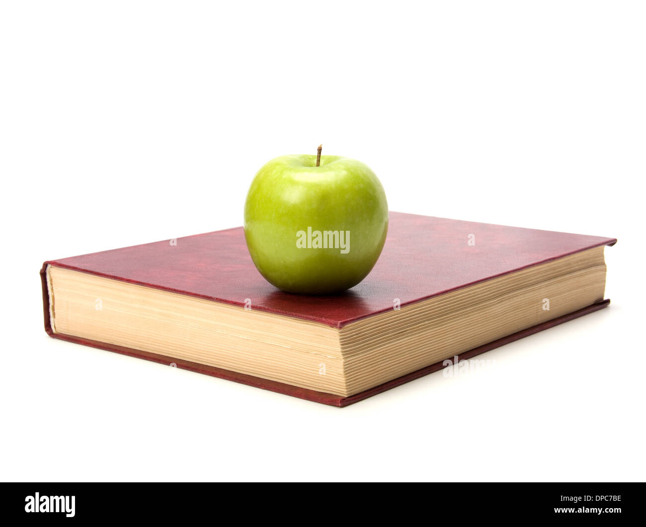 book with apple isolated on white background Stock Photo - Alamy