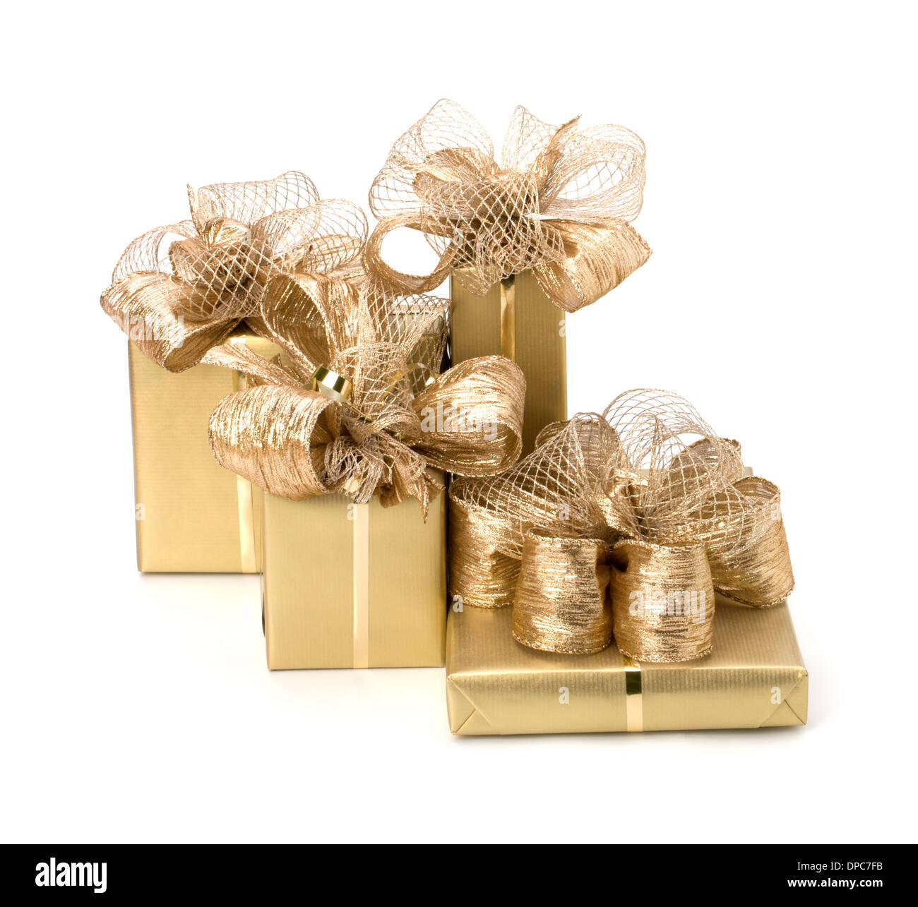 Gold gifts isolated on white background Stock Photo - Alamy