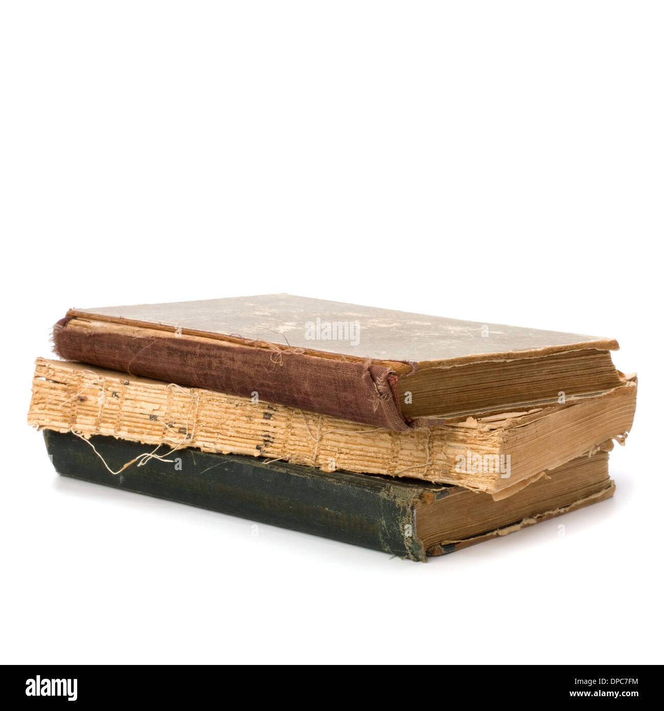 tattered book stack isolated on white background Stock Photo - Alamy
