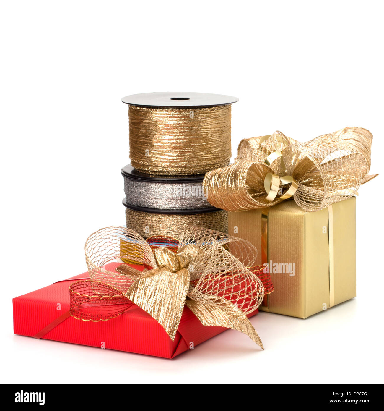 Festive gift box and wrapping ribbons isolated on white background ...