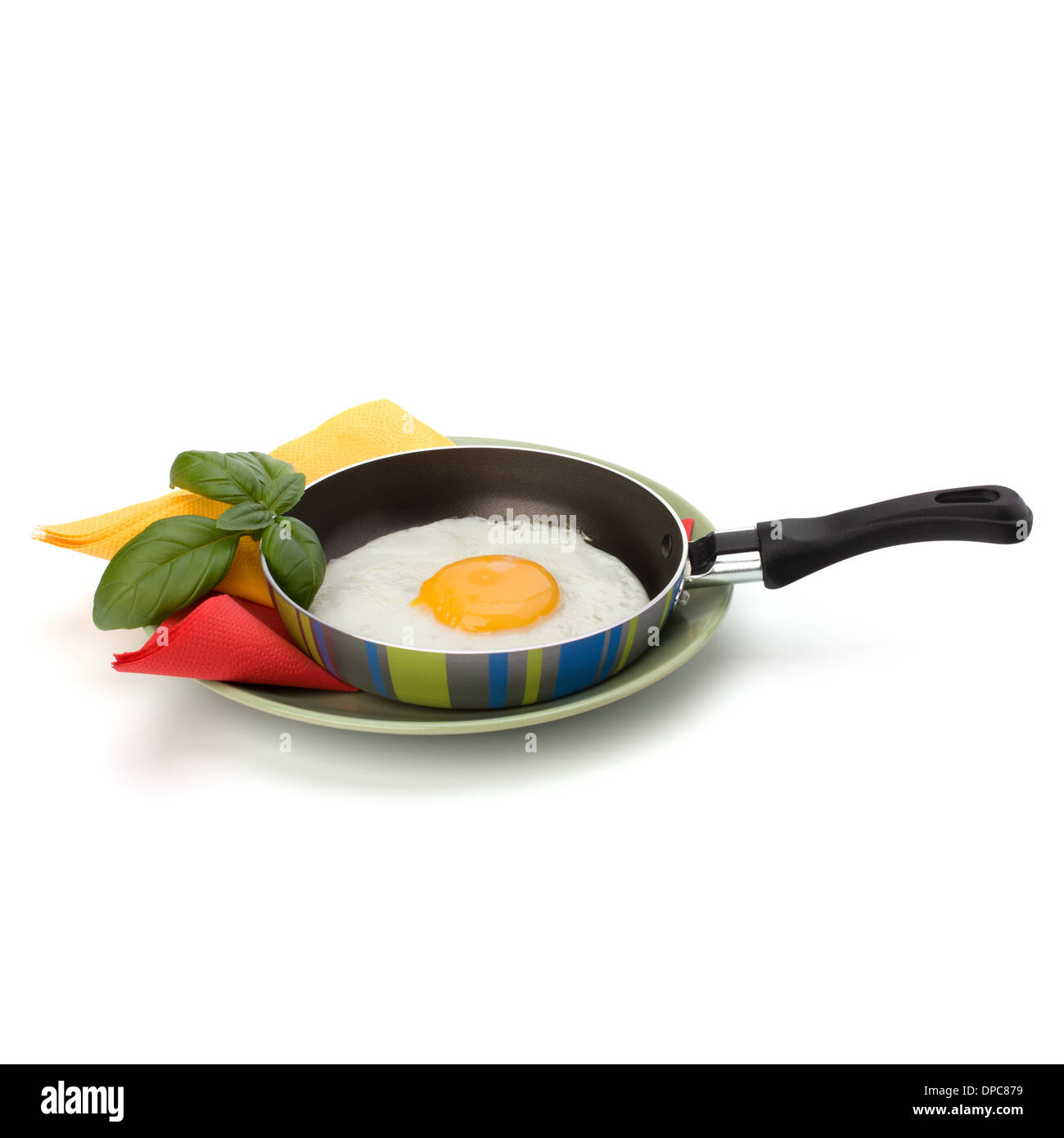 Fried egg on pan over white background Stock Photo - Alamy