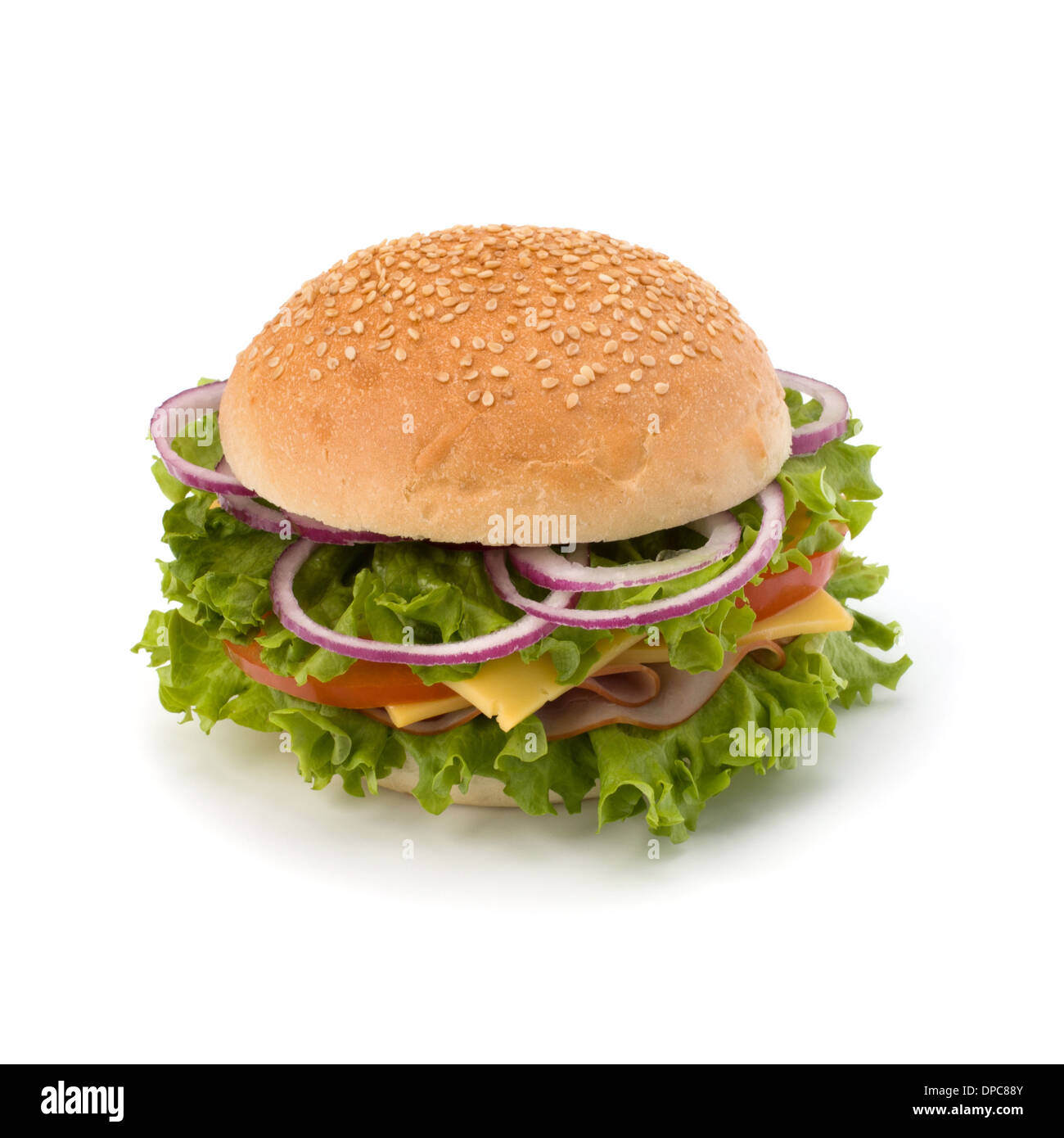 Big appetizing fast food sandwich with lettuce, tomato, smoked ham and ...