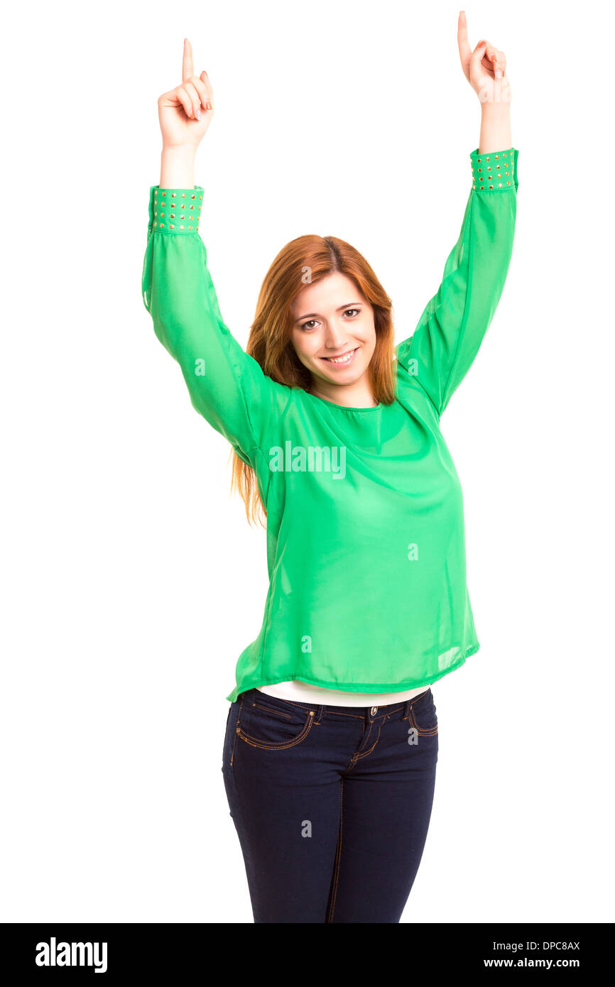 A beautiful woman pointing to something, isolated over a white ...