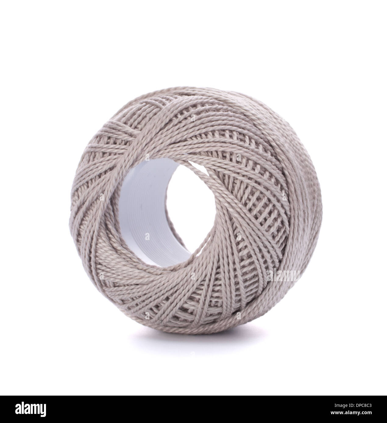 spool of grey thread isolated on white background Stock Photo - Alamy