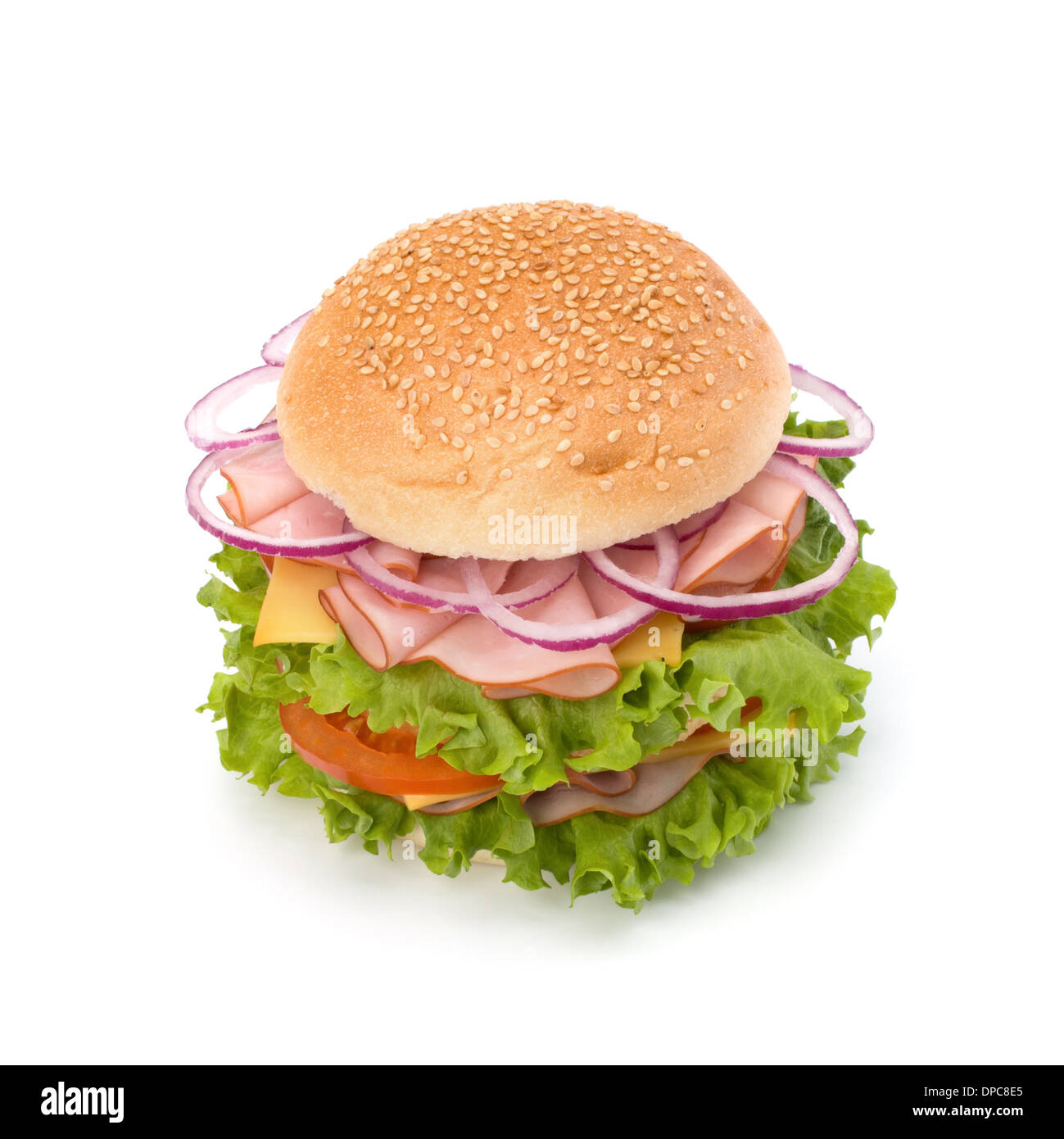Big appetizing fast food sandwich with lettuce, tomato, smoked ham and ...