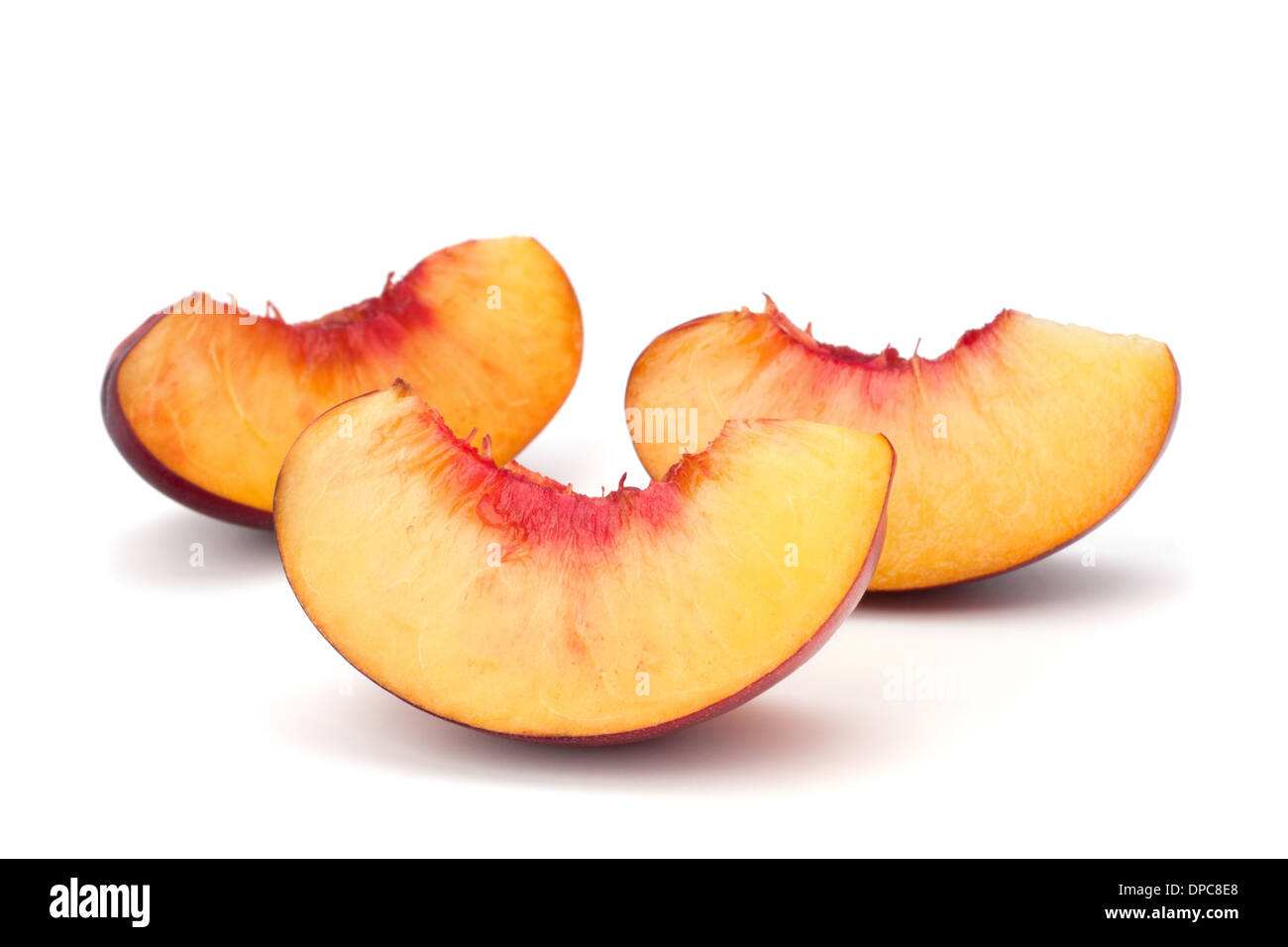 Nectarine fruit segments isolated on white background Stock Photo - Alamy
