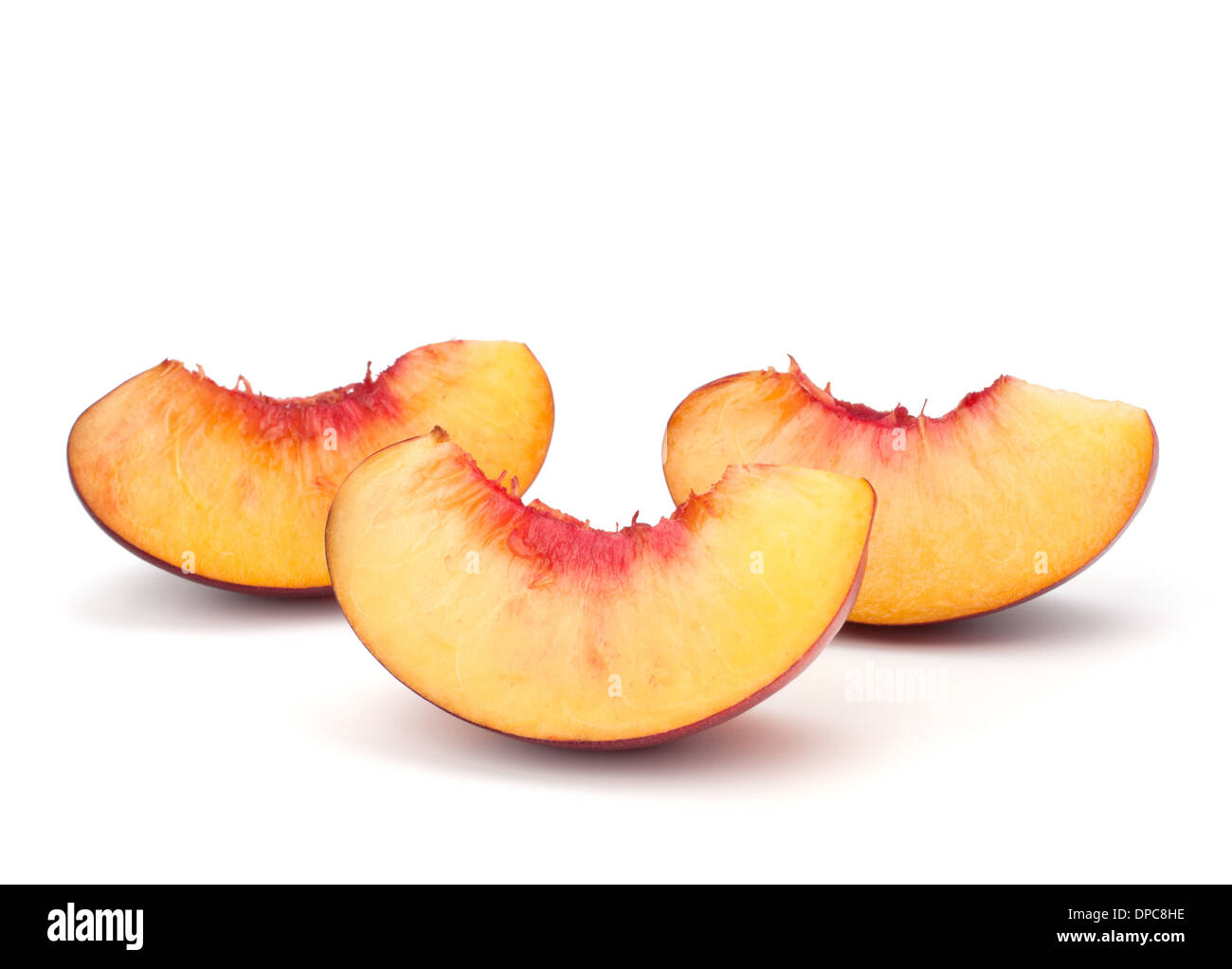 Nectarine fruit segments isolated on white background Stock Photo - Alamy
