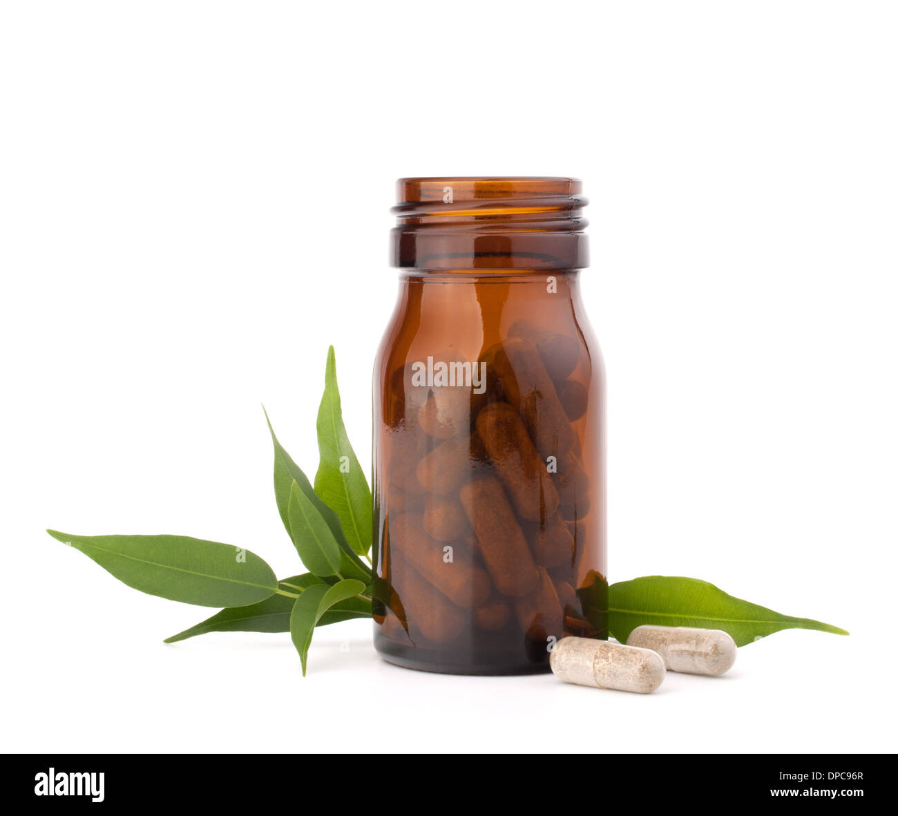 Herbal drug capsules in brown glass bottle isolated on white background ...